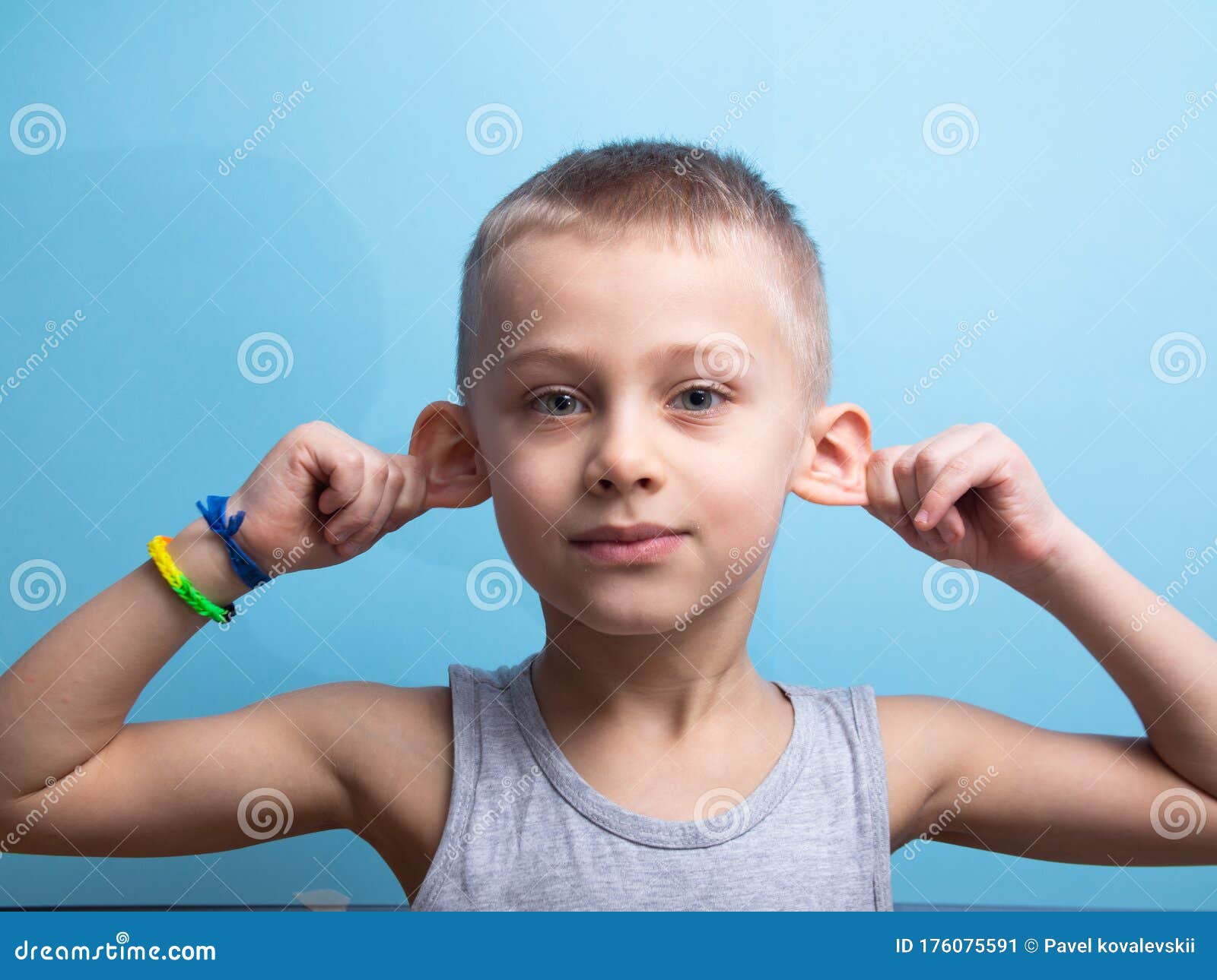 Child is Having Fun. the Boy Pulls Back His Ears Like a Monkey Stock ...