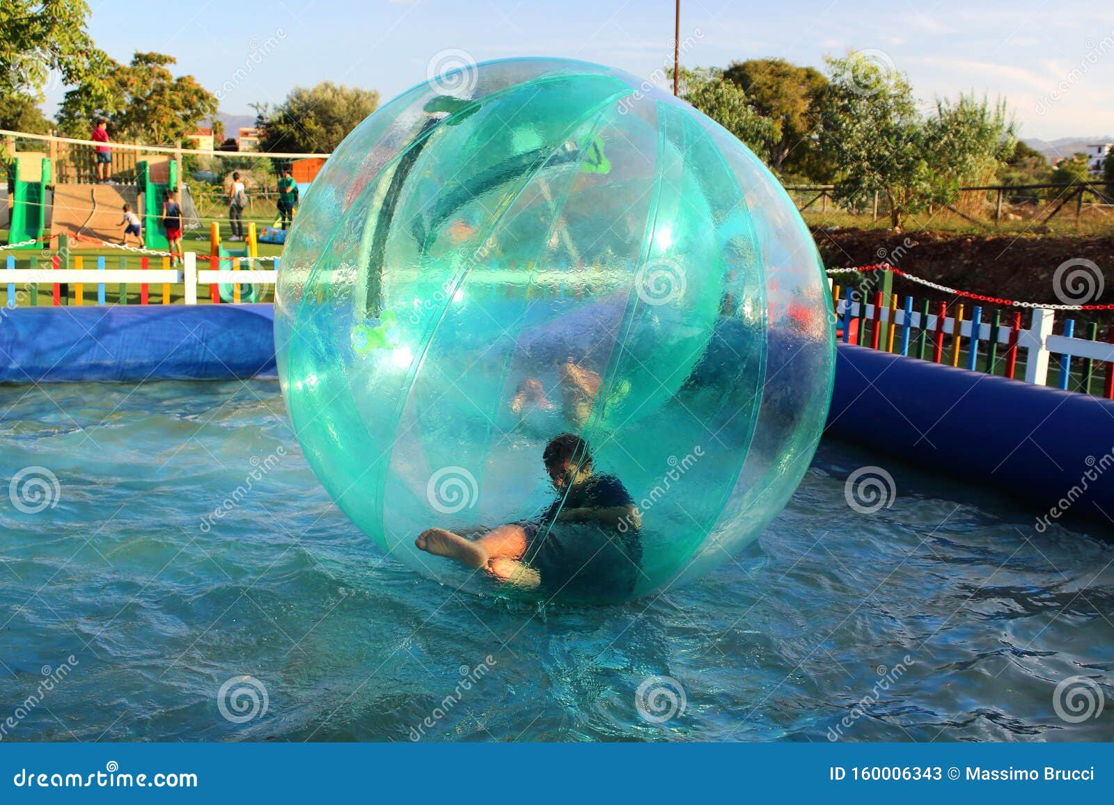 Child Having Fun Inside the Inflatable Ball Floating on the Water in ...