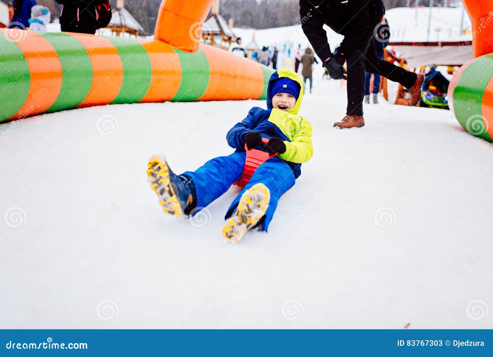 Child having fun on snow stock image. Image of outdoors - 83767303