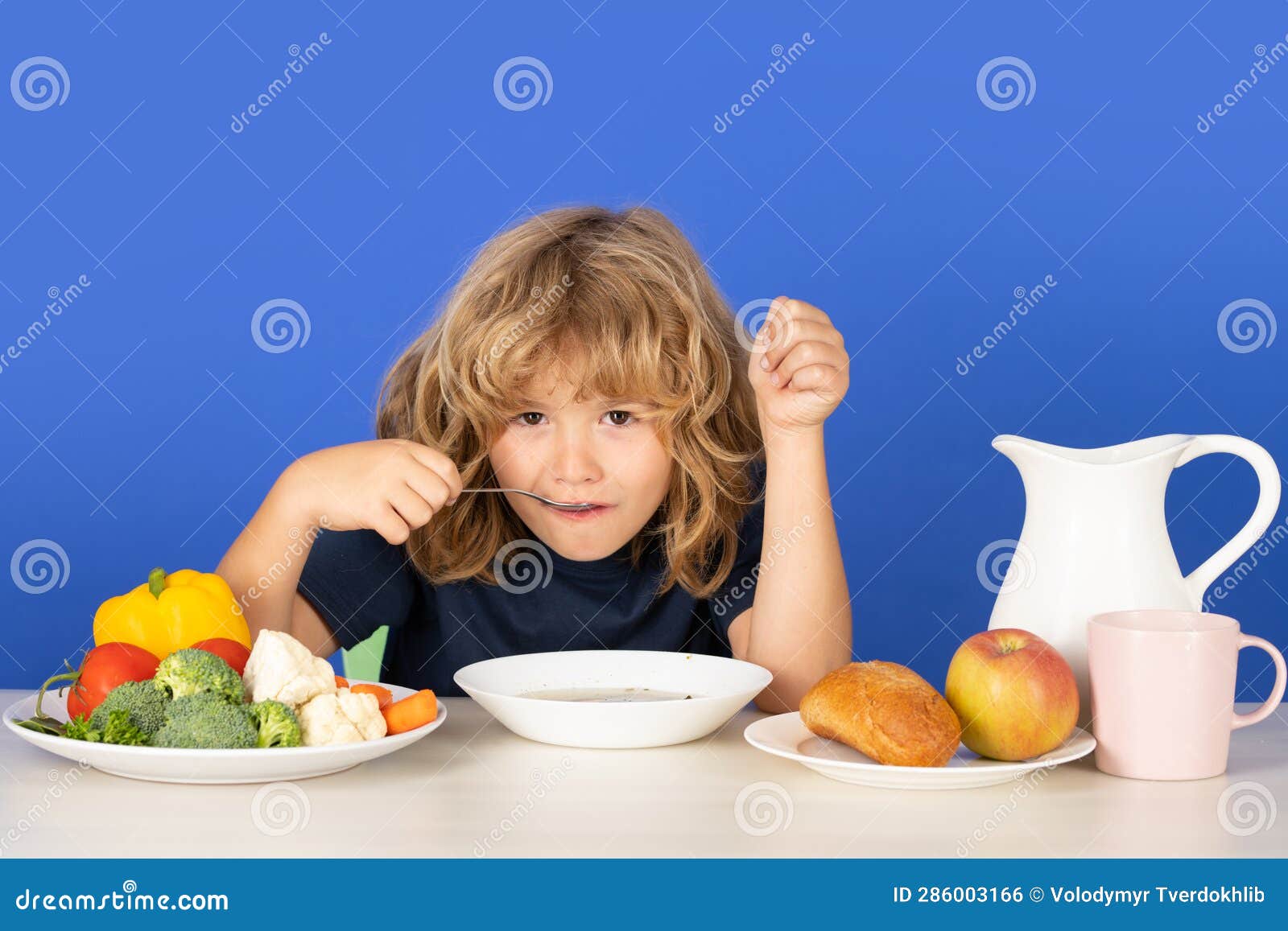 Child Having Lunch and Eating Soup. Kid Eating Soup. Stock Photo ...