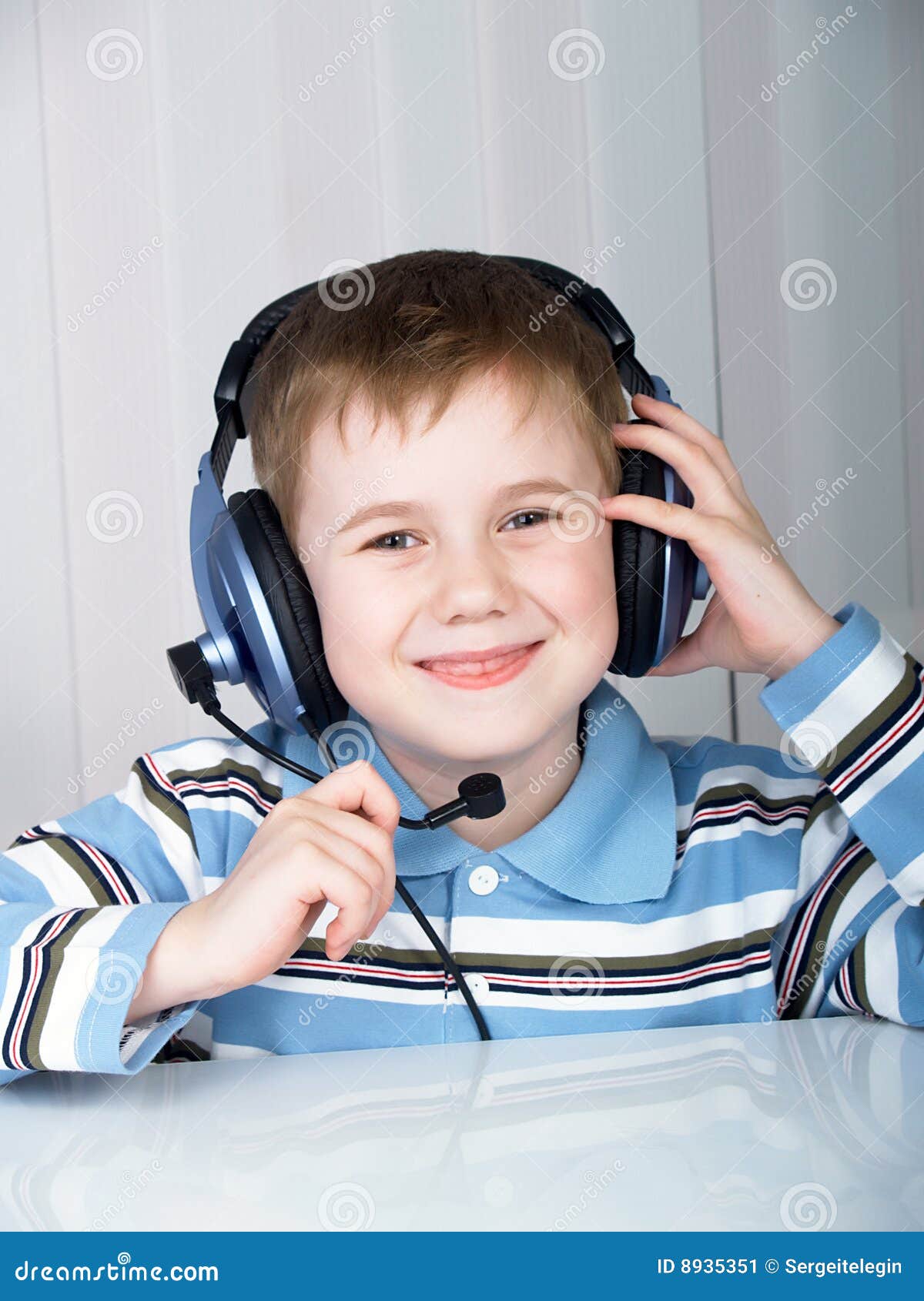 The child in headphones stock image. Image of child, emotion - 8935351