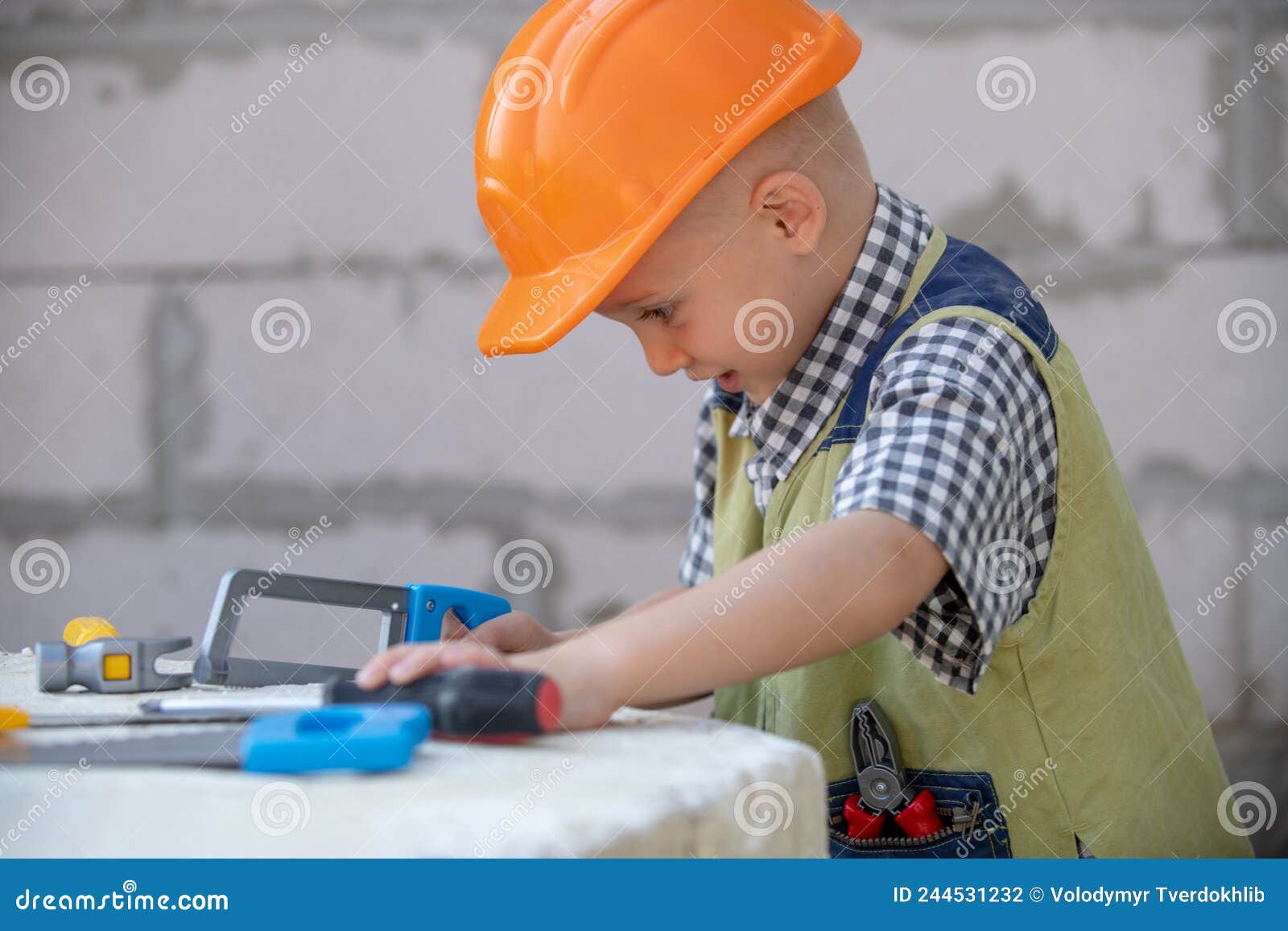 Child in Helmet is Construction Worker. Foreman Kid Work in the Hard ...