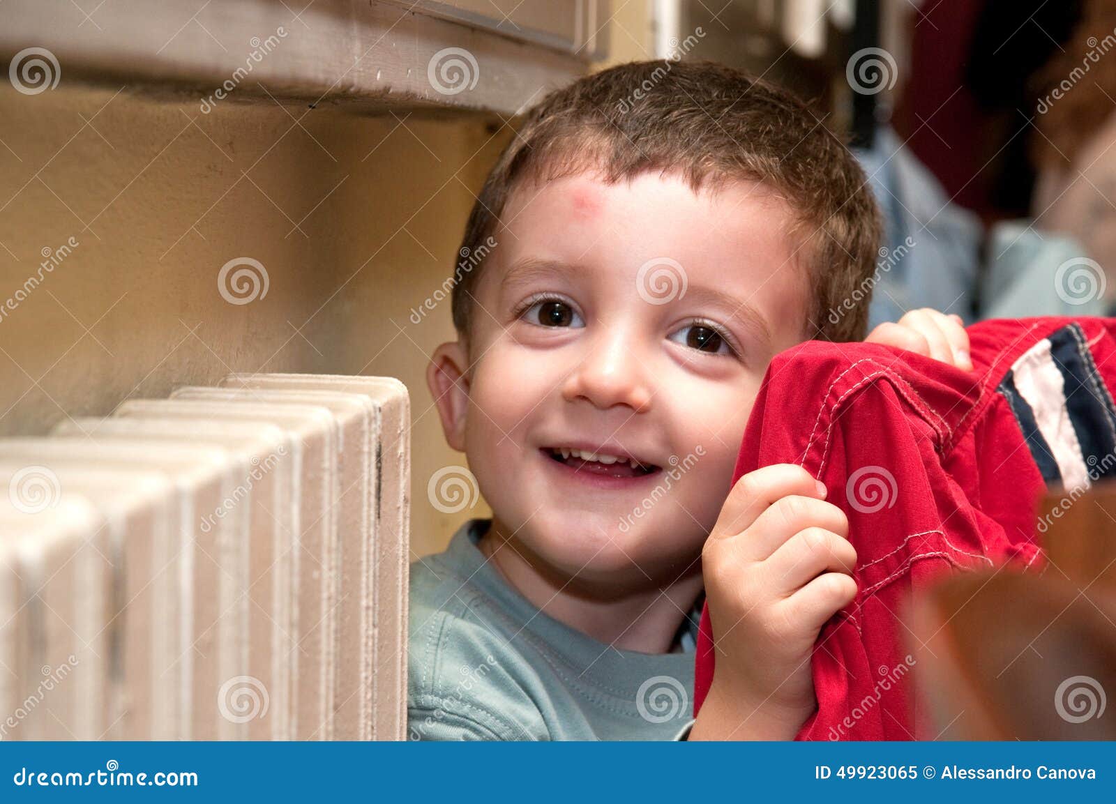 Child hides stock image. Image of happy, little, smile - 49923065