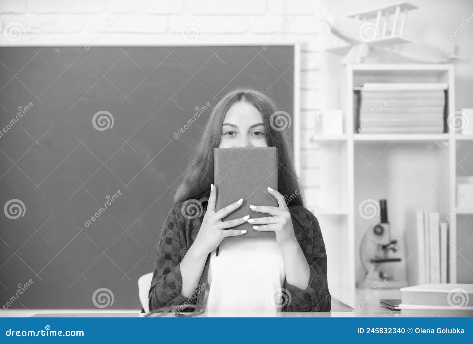 Child Hiding Behind Book at School on Blackboard Background, Knowledge ...