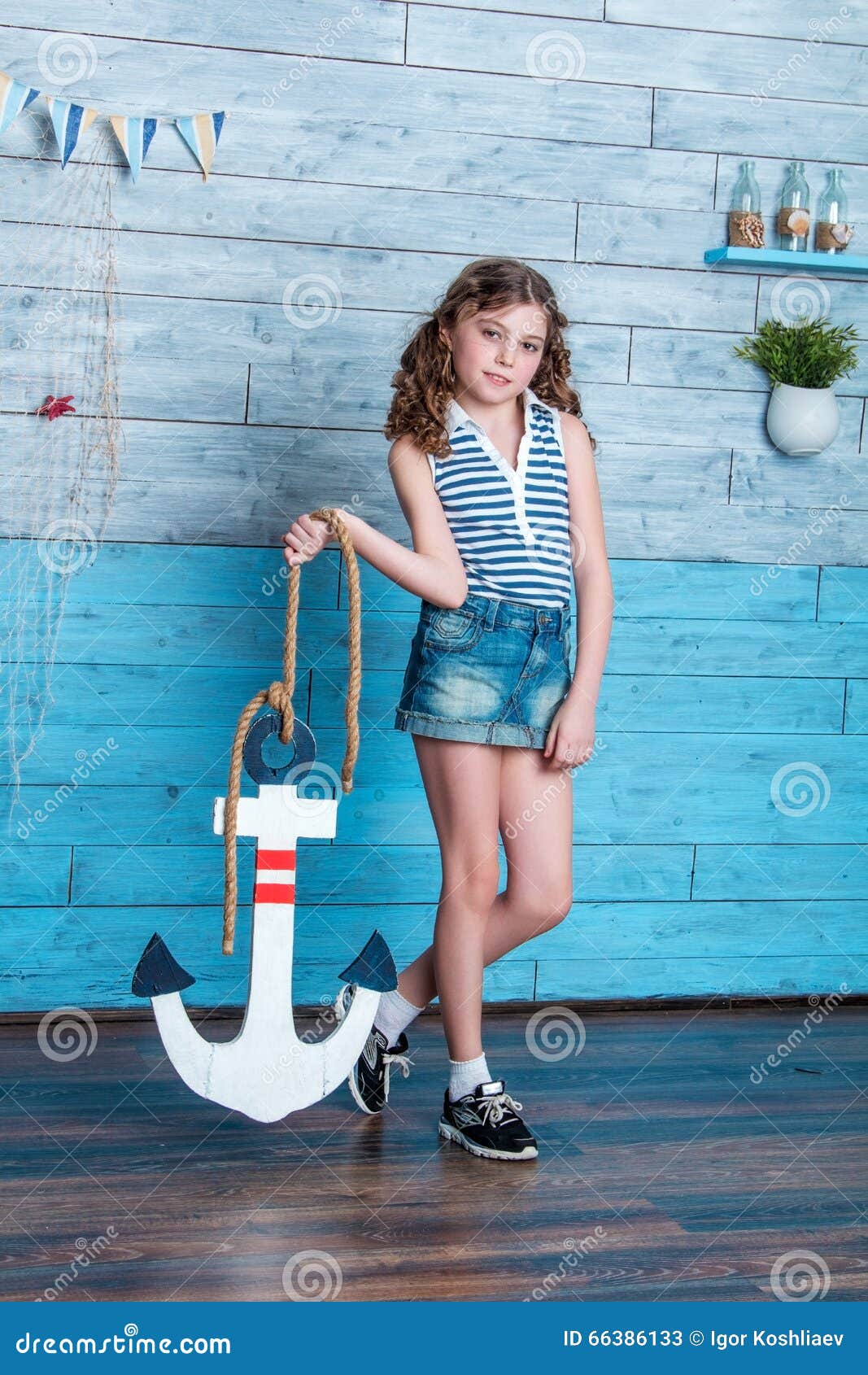 Child holding anchor stock image. Image of looking, brunette - 66386133