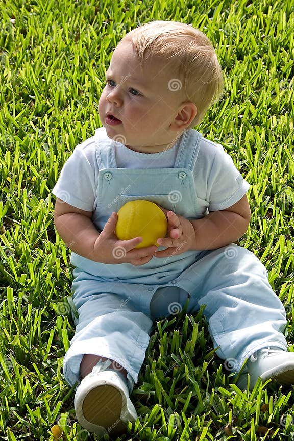 Child holding ball stock image. Image of yellow, summery - 8639587