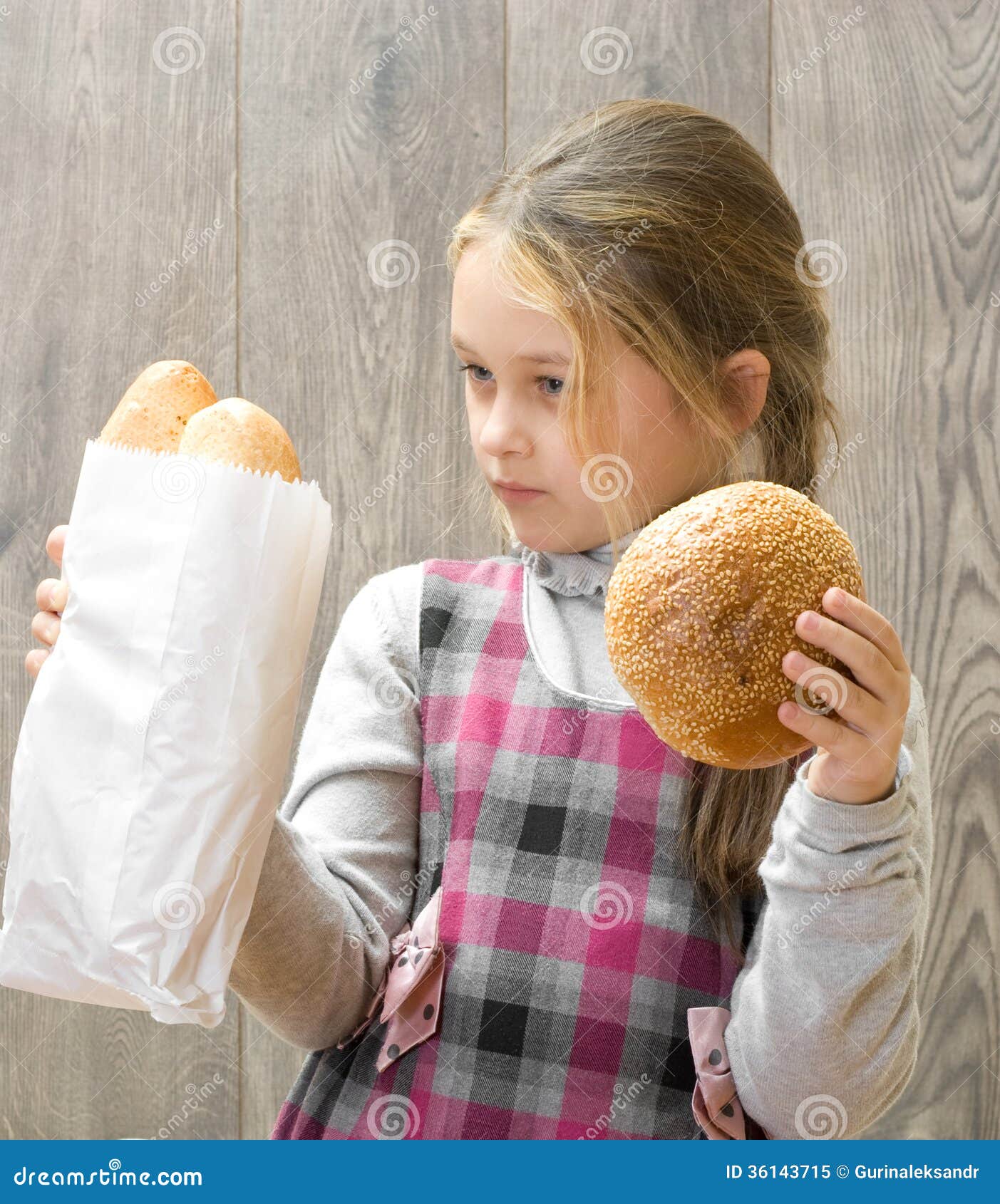Child holding a bread stock image. Image of products - 36143715