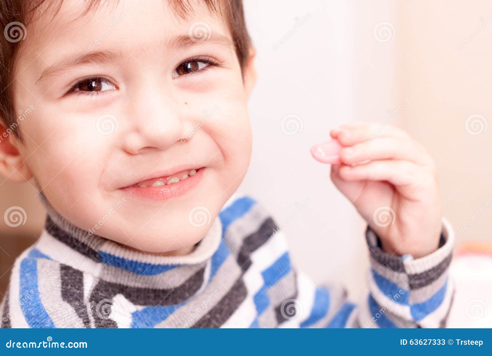 Child Holding Candy and Smiling Stock Image - Image of childhood ...
