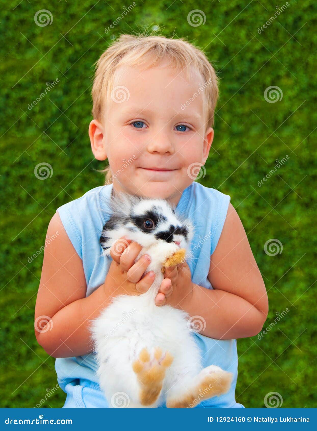Child Holding on Hands of a Small Rabbit Stock Photo - Image of people ...