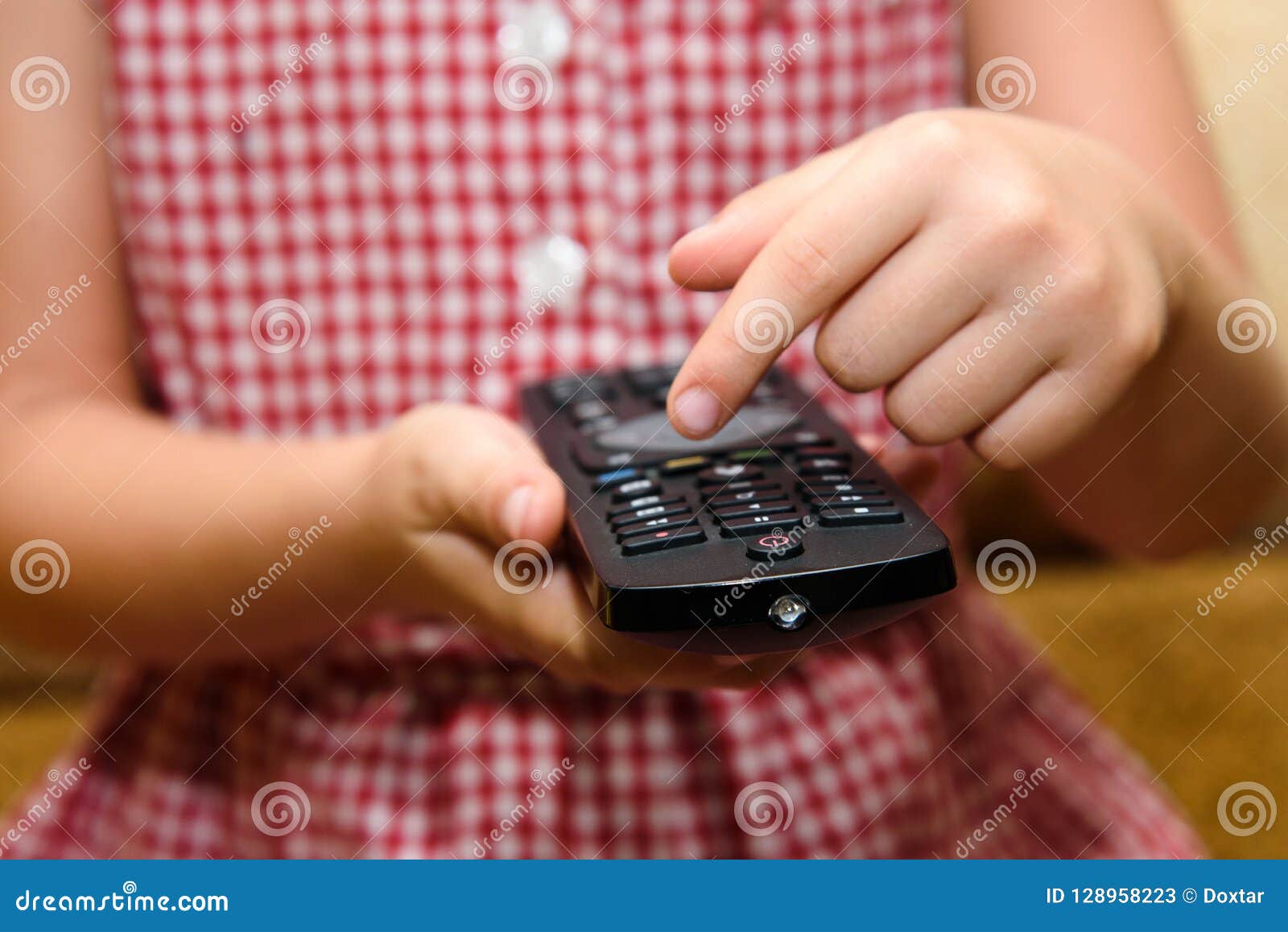 Child holding remote TV stock image. Image of hand, media - 128958223