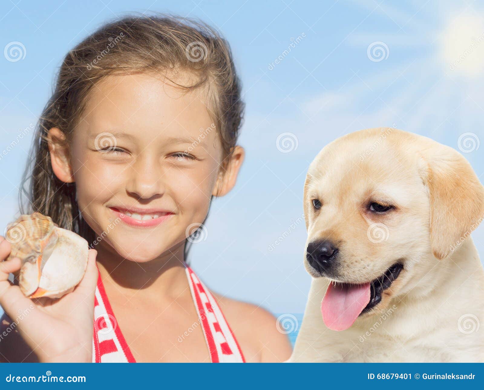 Child Holding a Shell and Labrador Puppy Stock Image - Image of ...