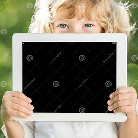 Child holding tablet PC stock photo. Image of computer - 29014670
