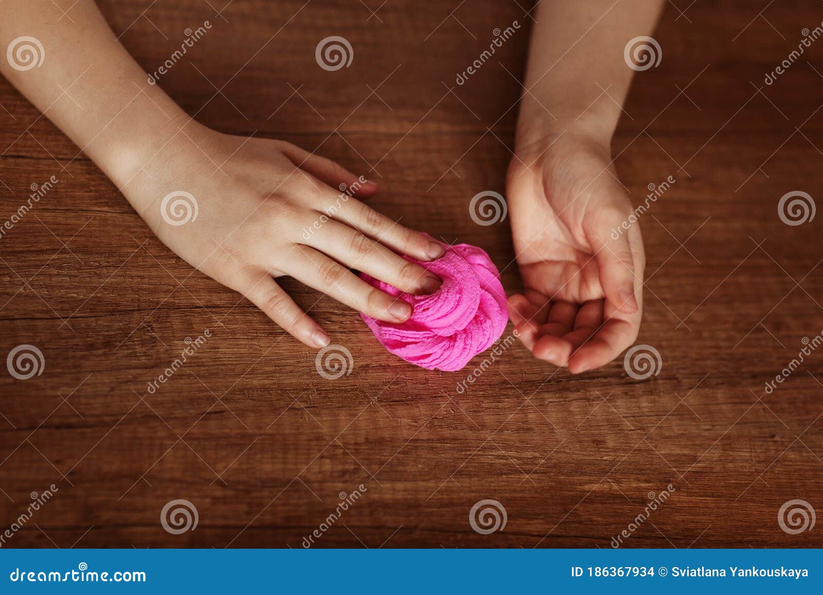 The Child is Holding a Toy Called Mucus, the Child is Having Fun and ...
