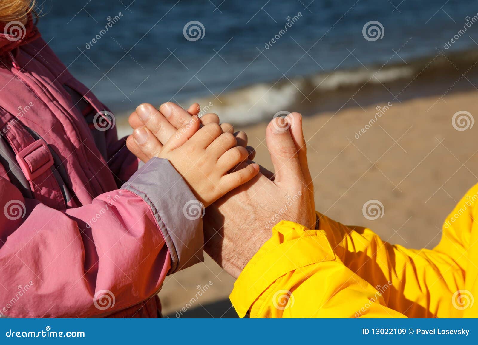 Child holds hand of adult. stock image. Image of assistance - 13022109