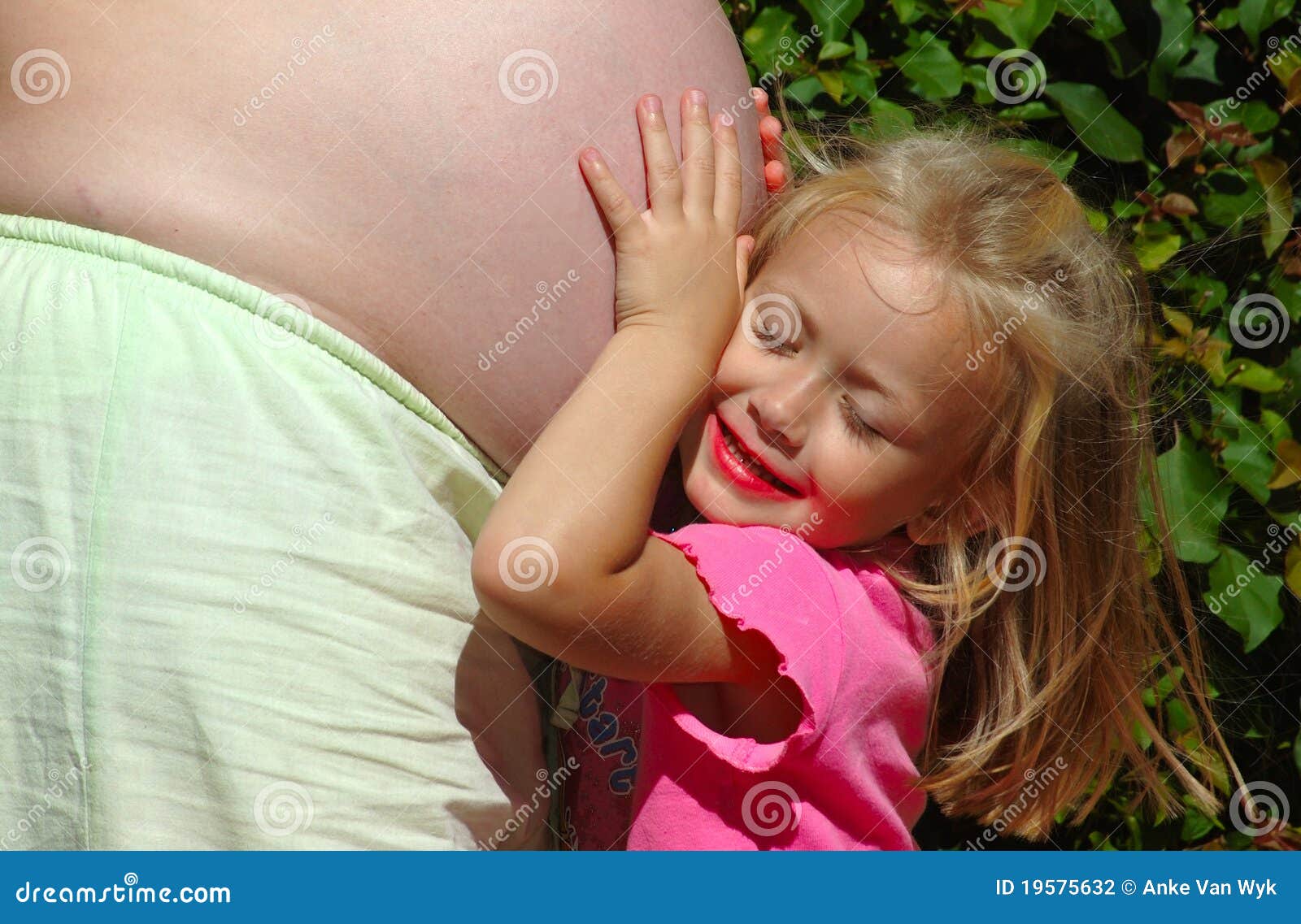Child Hugging Mom Pregnant Belly Stock Photo - Image of expecting ...