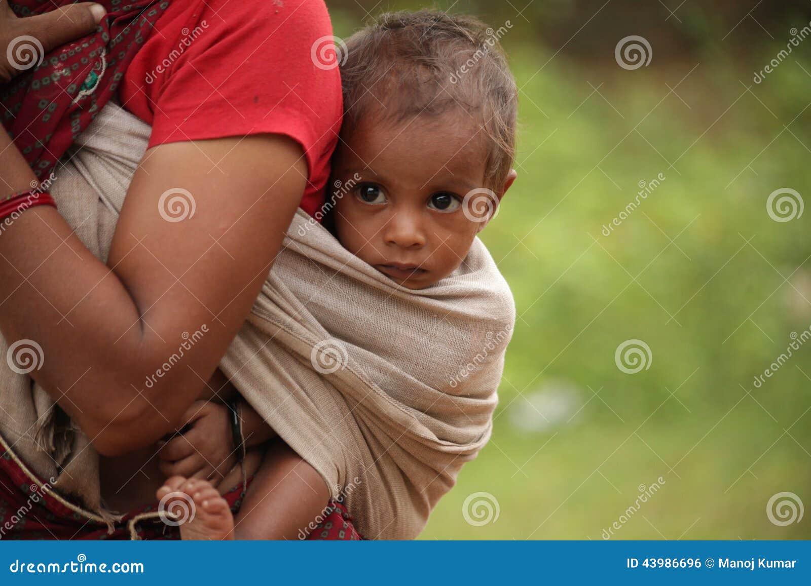 Carrying Child on back editorial photo. Image of carry - 43986696