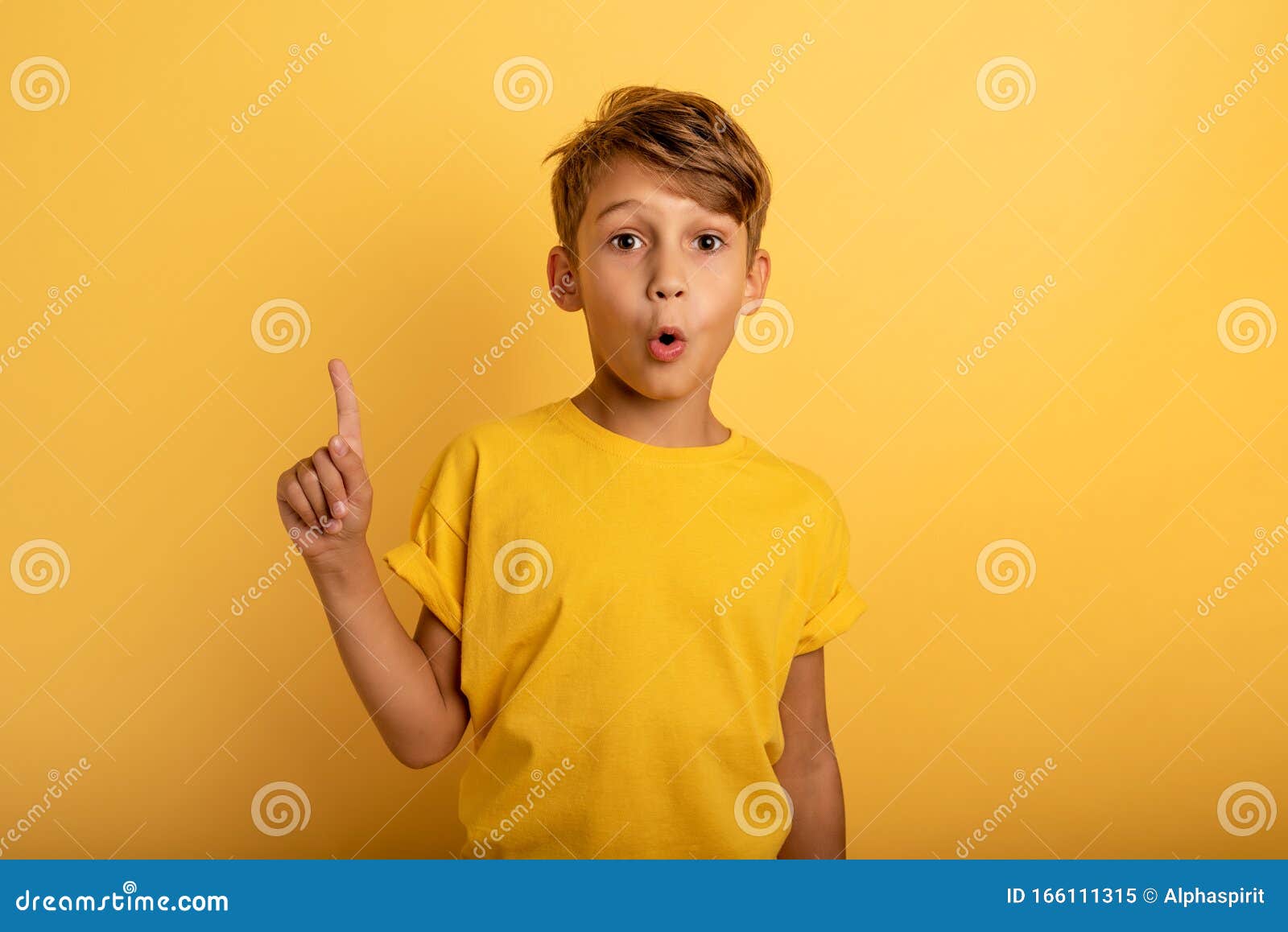 Child Indicates Above. Amazed and Shocked Expression. Yellow Background ...