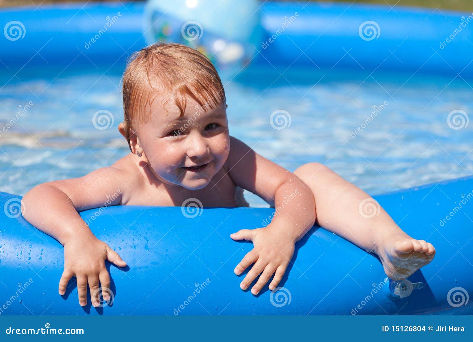 Child in inflatable pool stock photo. Image of portrait - 15126804