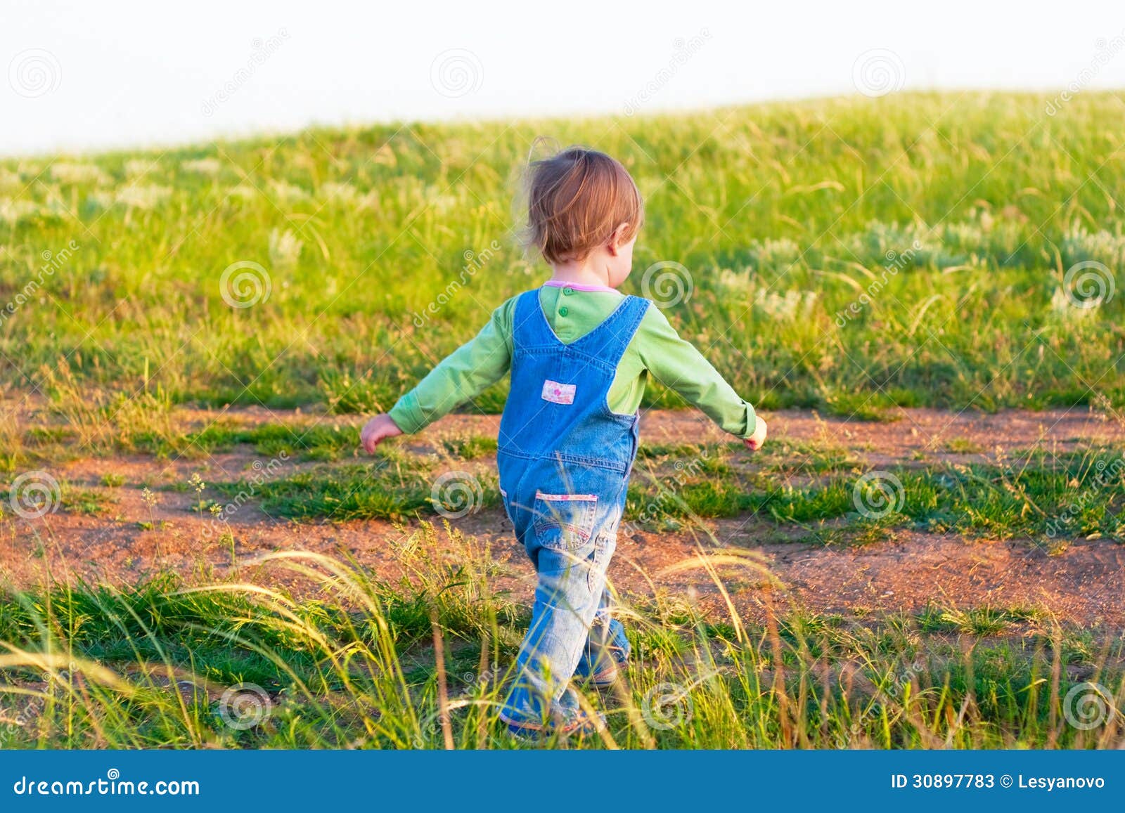 Child in the Jeans Coverall Walk with Vigorous Strides Stock Image ...
