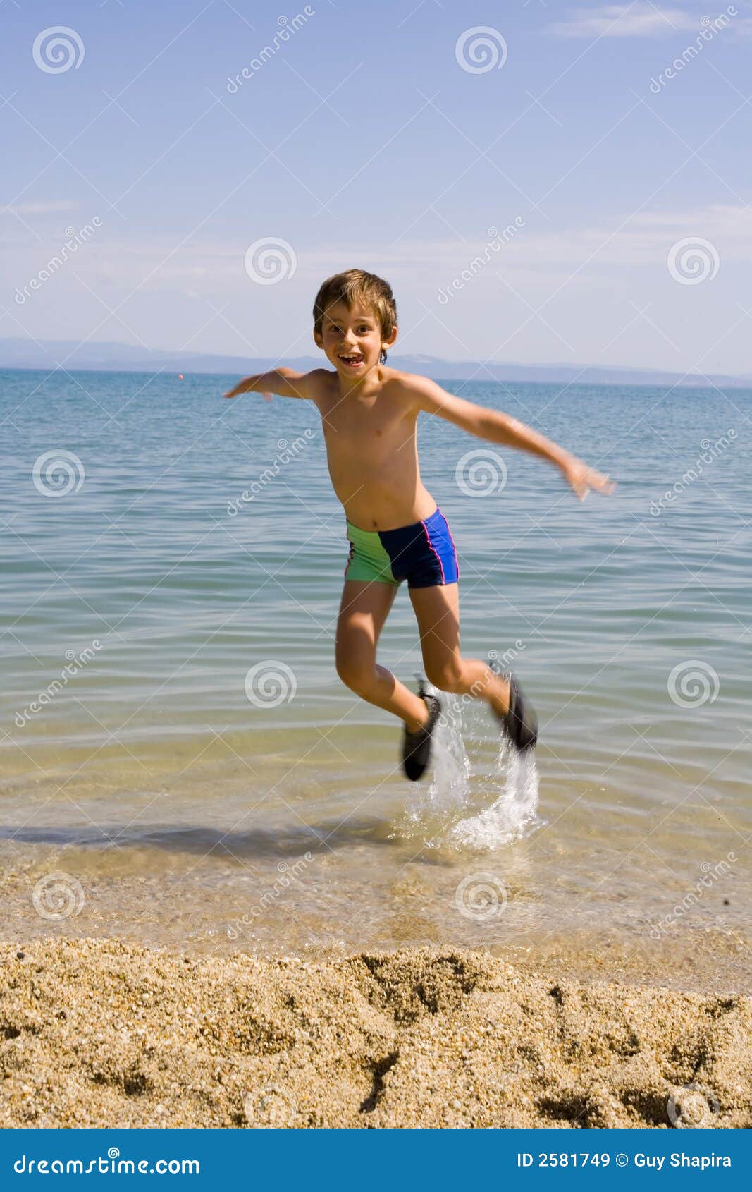 Child jump on seacoast stock image. Image of coast, sand - 2581749
