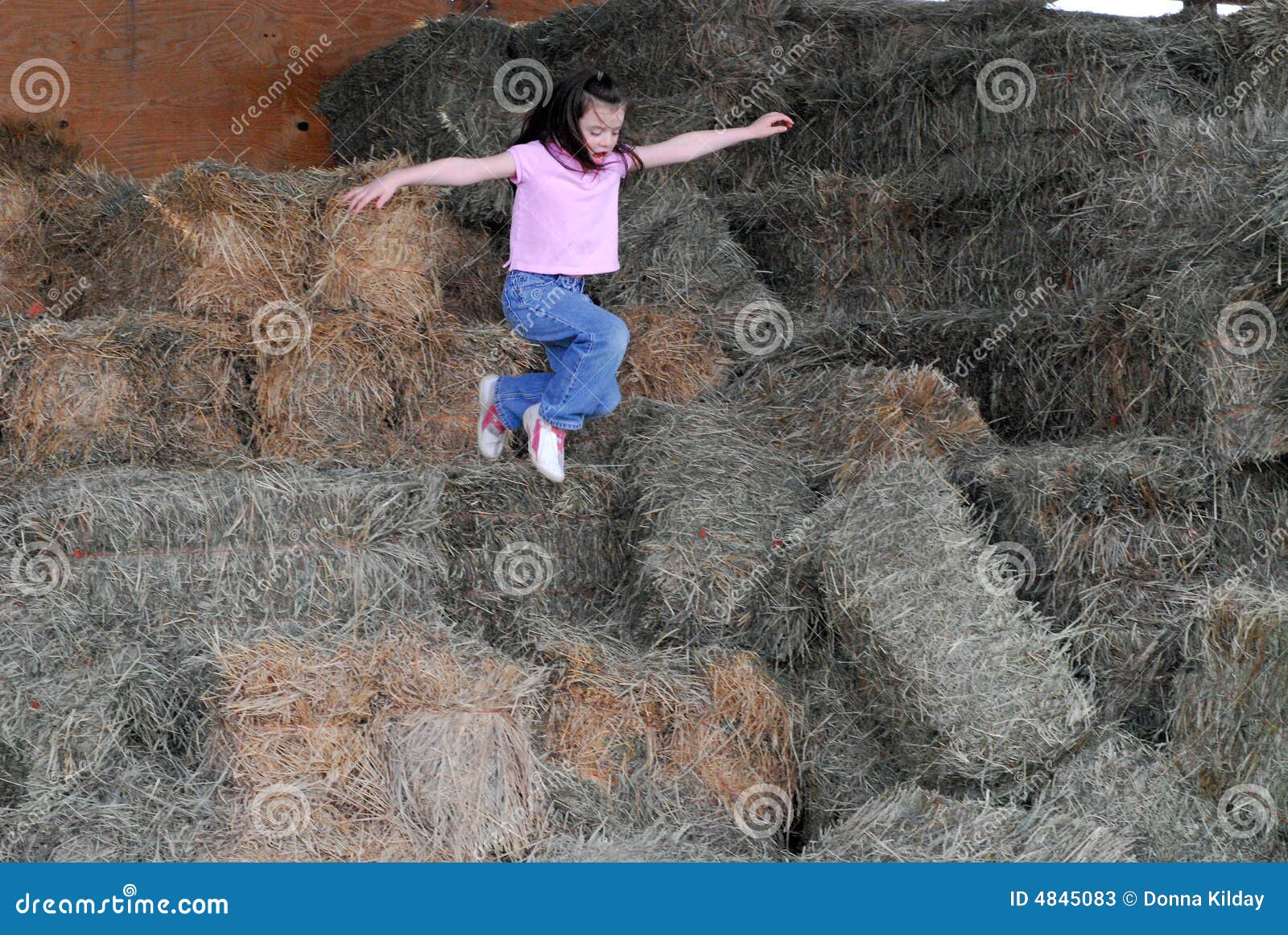 Child jumping stock image. Image of barn, girl, stack - 4845083