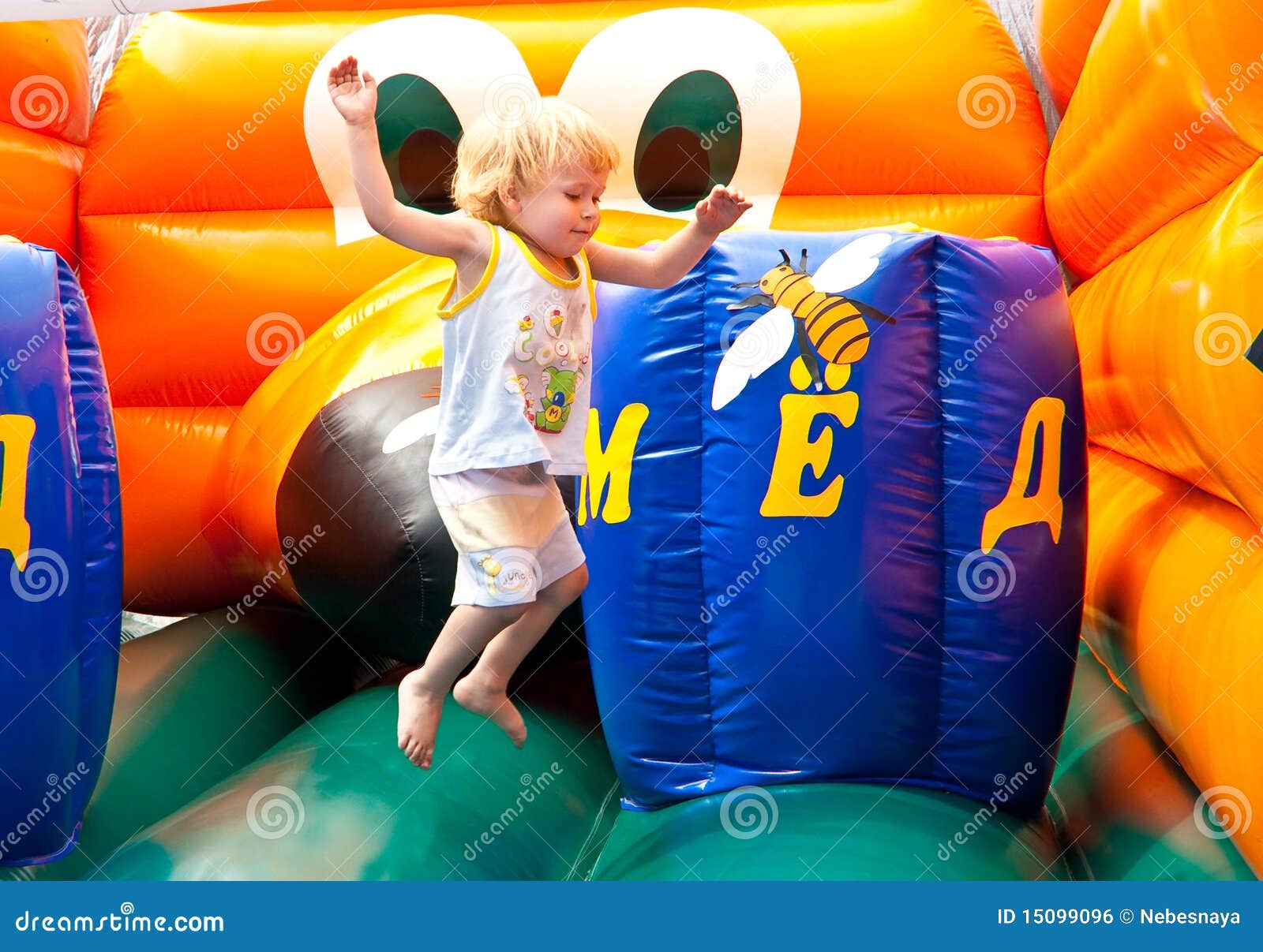 Child Jumping On Bouncy Castle Stock Photo | CartoonDealer.com #15099096