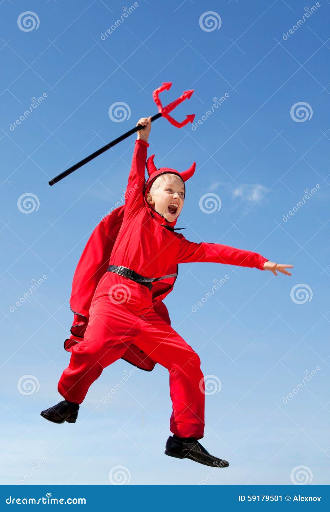 Child Jumping in a Devil Costume and Holding a Trident Stock Image ...