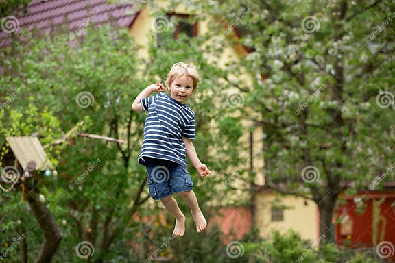 Child, Jumping High on a Trampoline Stock Image - Image of laughing ...