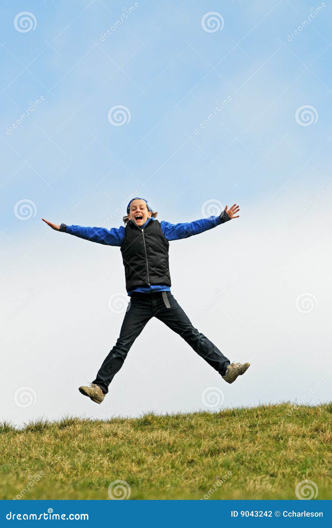Child jumping for joy stock photo. Image of outside, casual - 9043242
