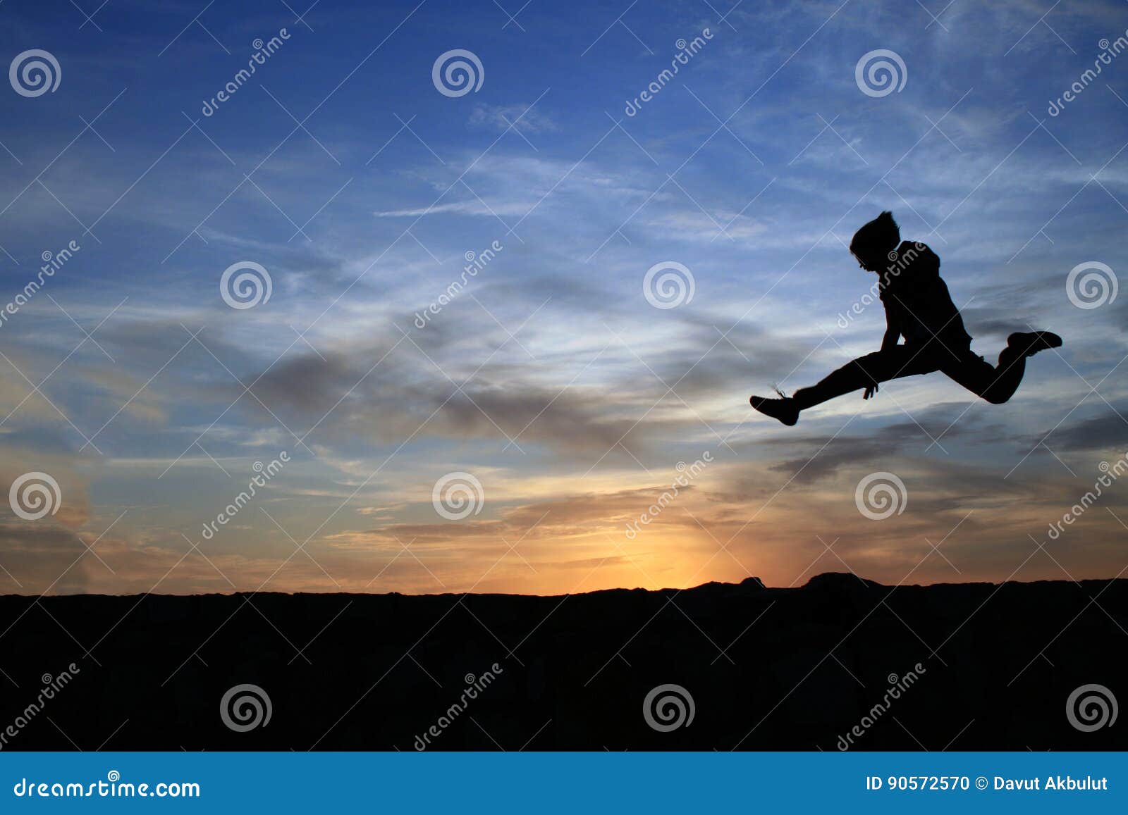 Child jumping over rocks stock photo. Image of silhouette - 90572570
