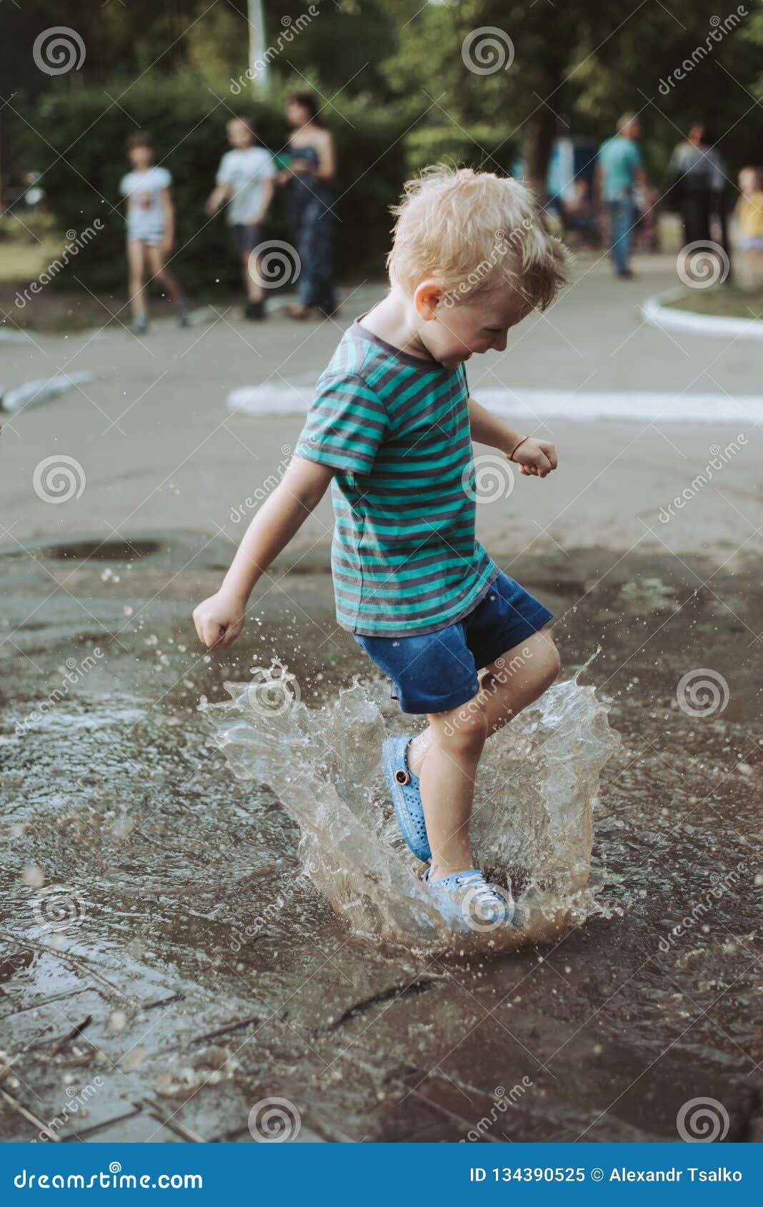 Little Boy Jumping in a Puddle in Summer Stock Image - Image of color ...