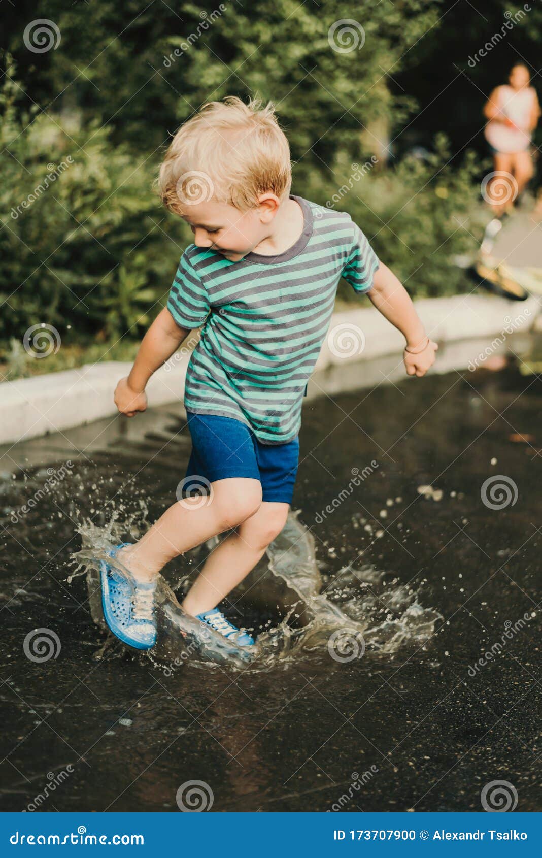 Little Boy Jumping in a Puddle in Summer Stock Photo - Image of flood ...