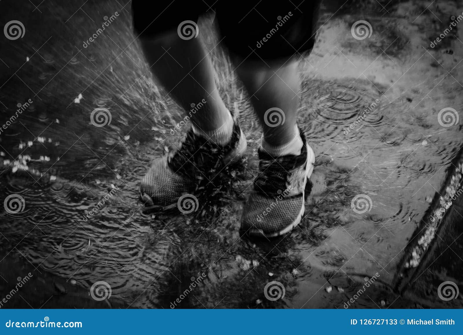 Splash from a Child Jumping in a Rain Puddle Stock Image - Image of ...