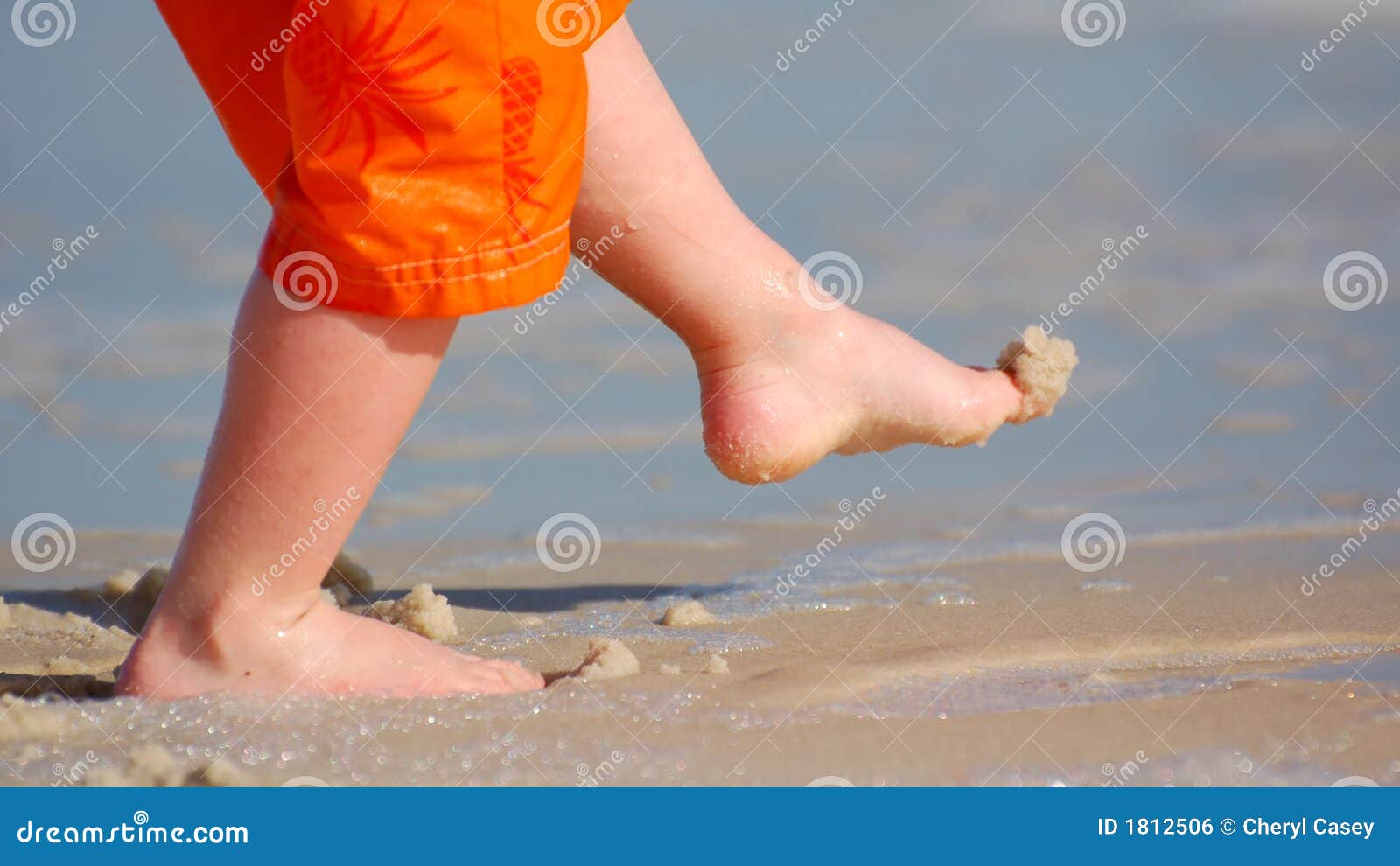 Child Kicking Sand stock photo. Image of playing, seashore - 1812506