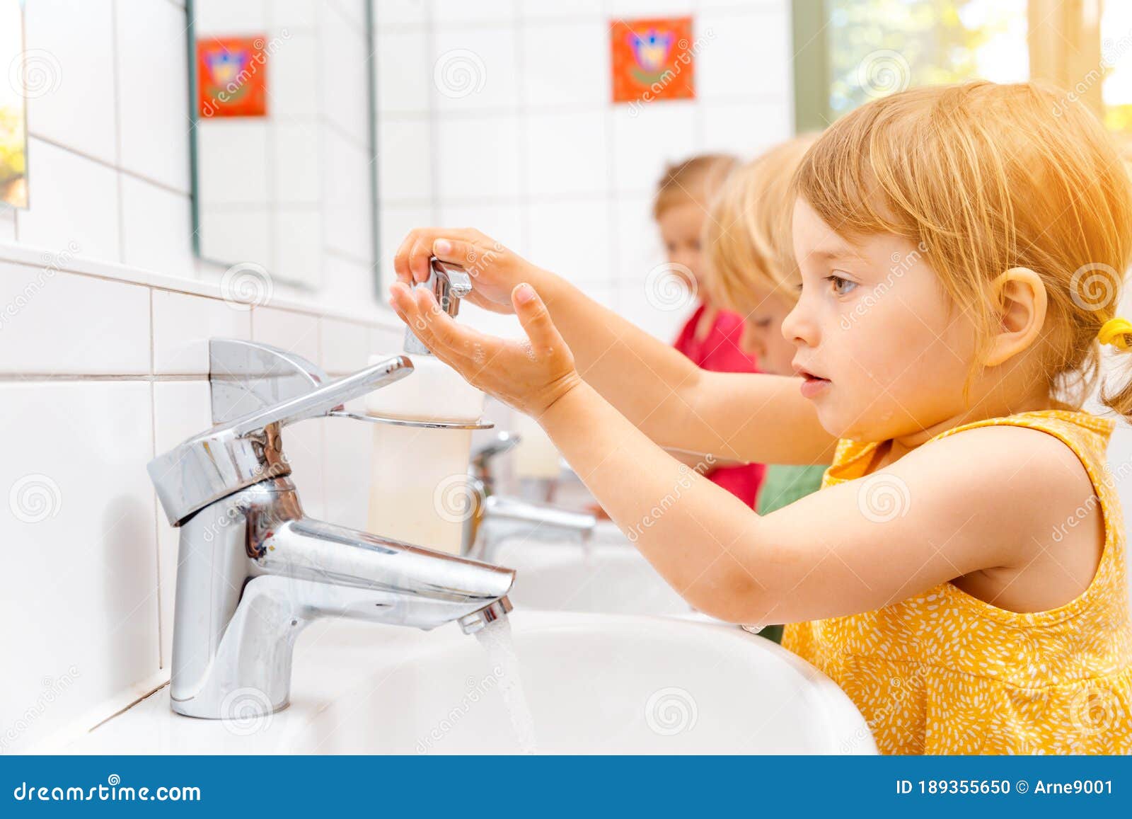 Hands Washing And Cleaning Squash Or Zucchini Vegetable Under Stream Of ...