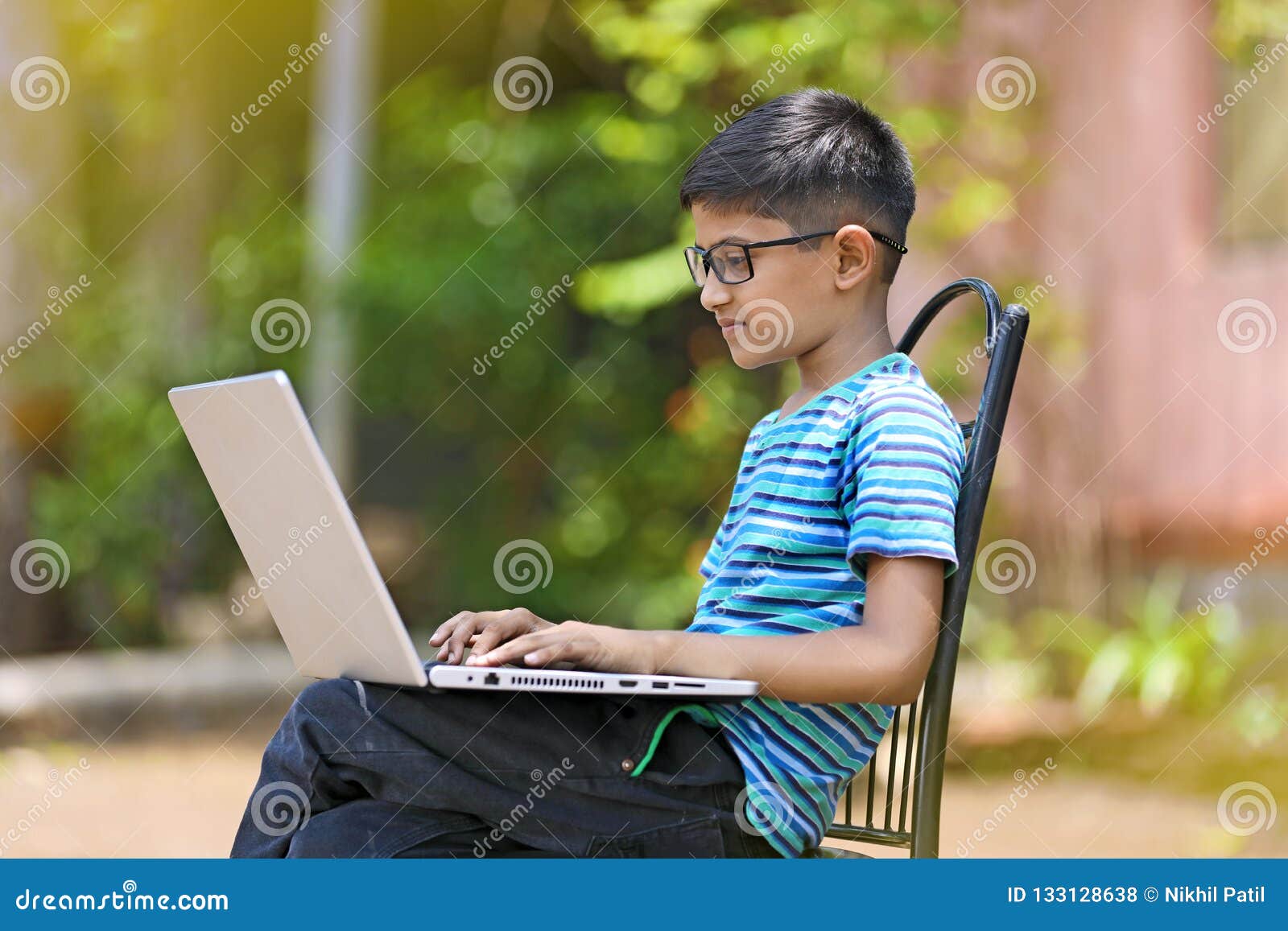 Child on laptop stock photo. Image of happy, looking - 133128638