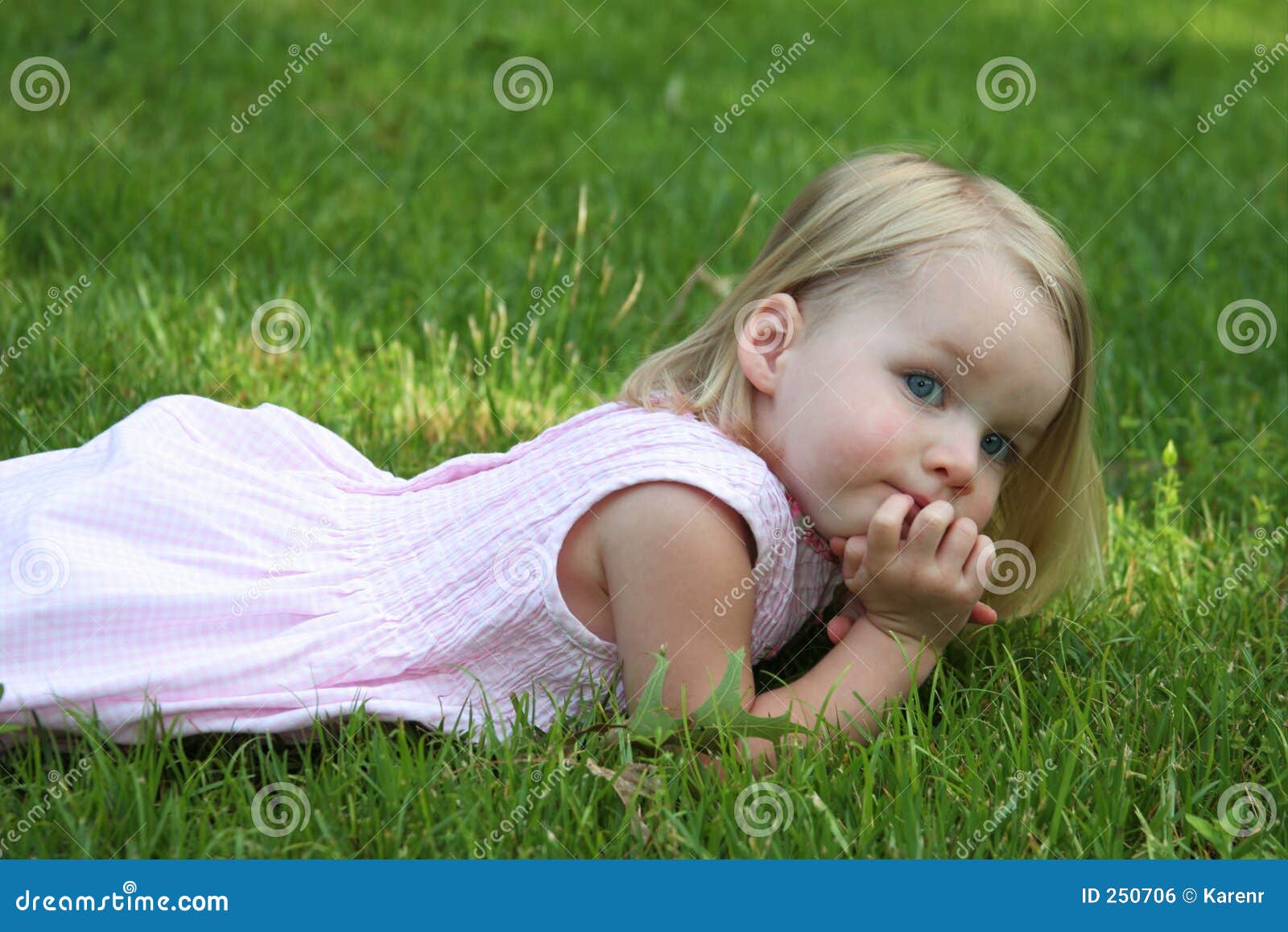 Child laying on grass stock photo. Image of outdoors, laying - 250706
