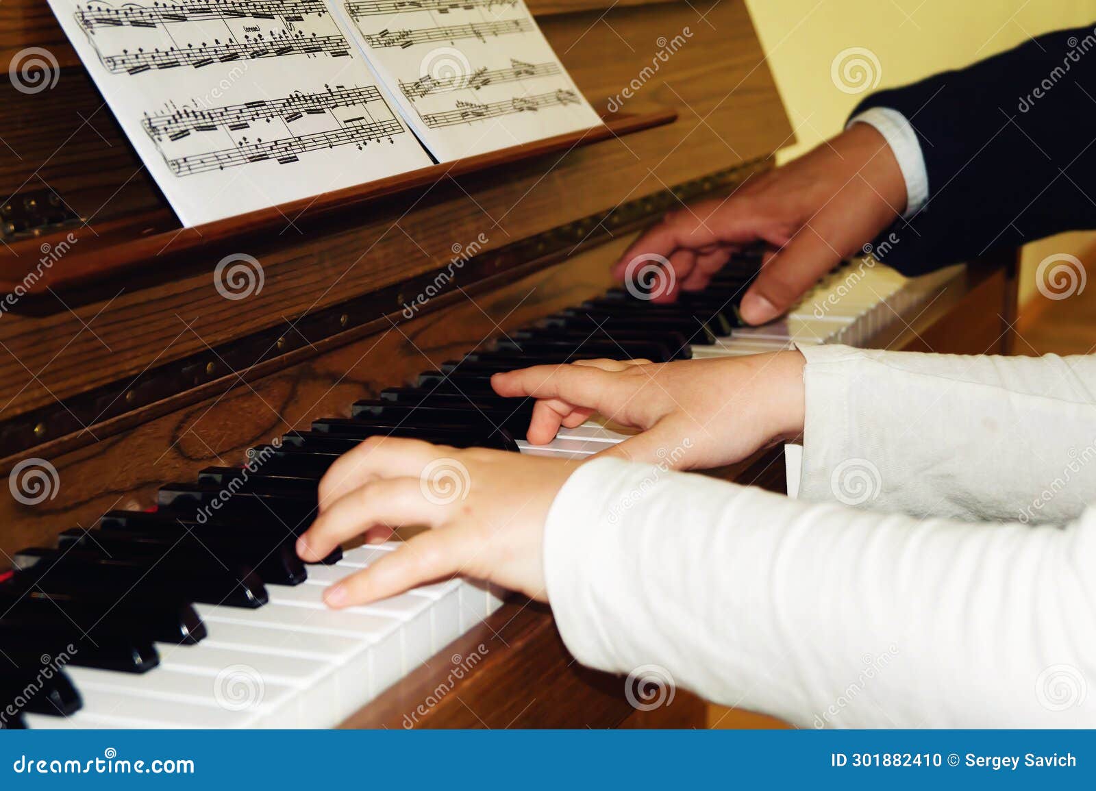 Child Learning Music on a Keyboard with a Teacher Stock Photo - Image ...