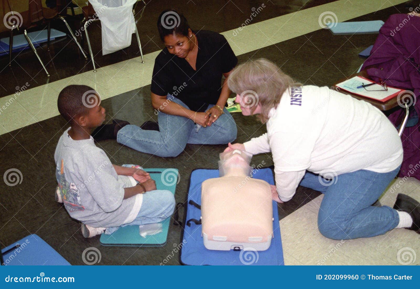 Child and Learning CPR at a Community Center Editorial Image - Image of ...