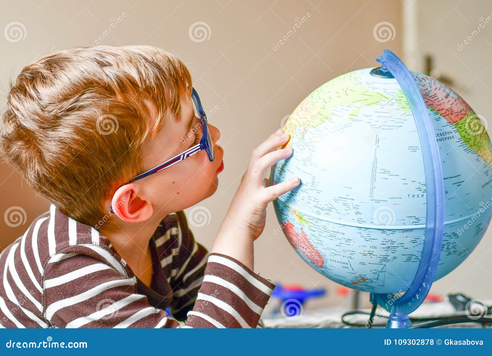 Child Learning Geography with Globe at Home Stock Photo - Image of ...