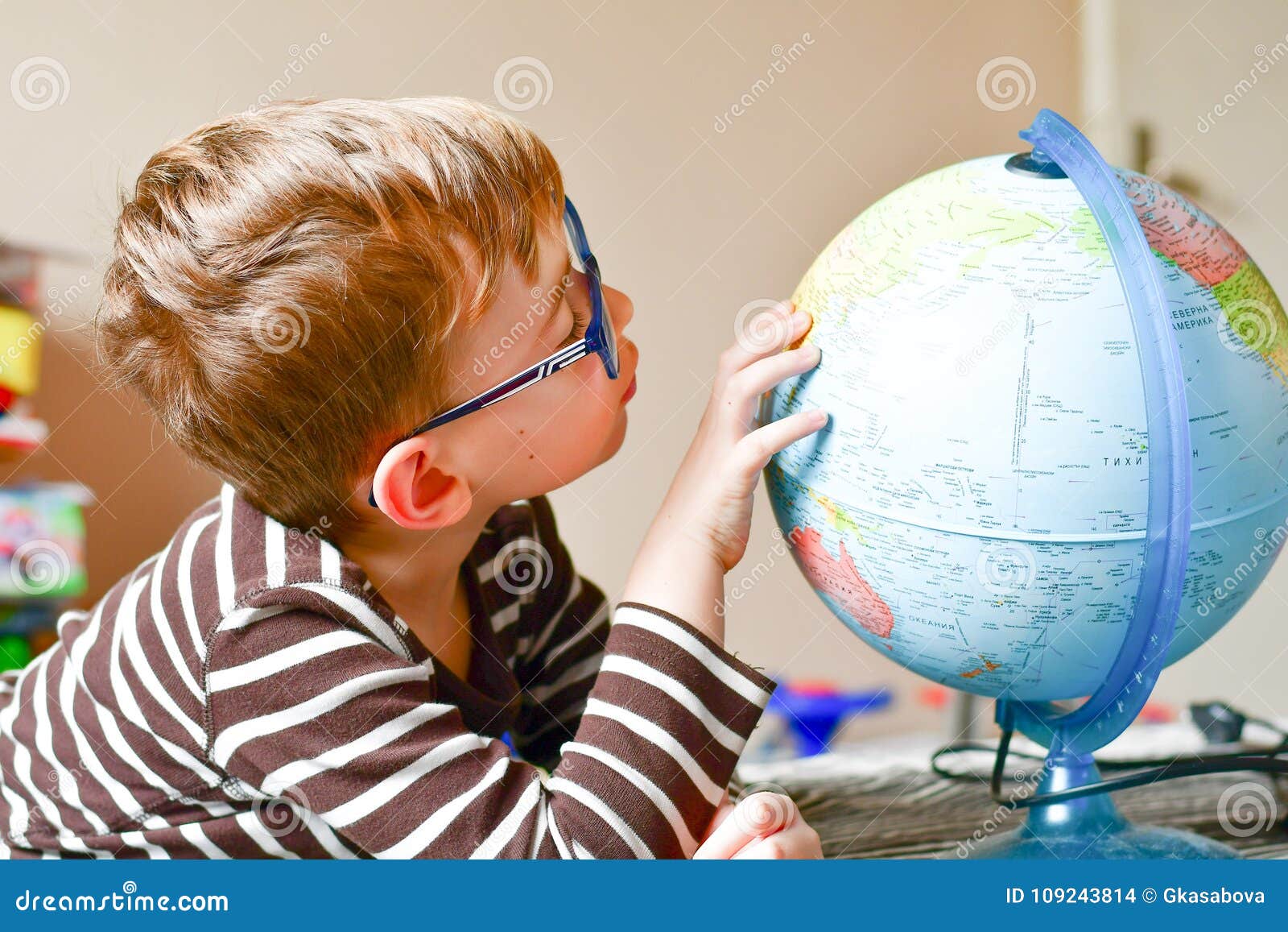 Child Learning Geography with Globe at Home Stock Photo - Image of ...