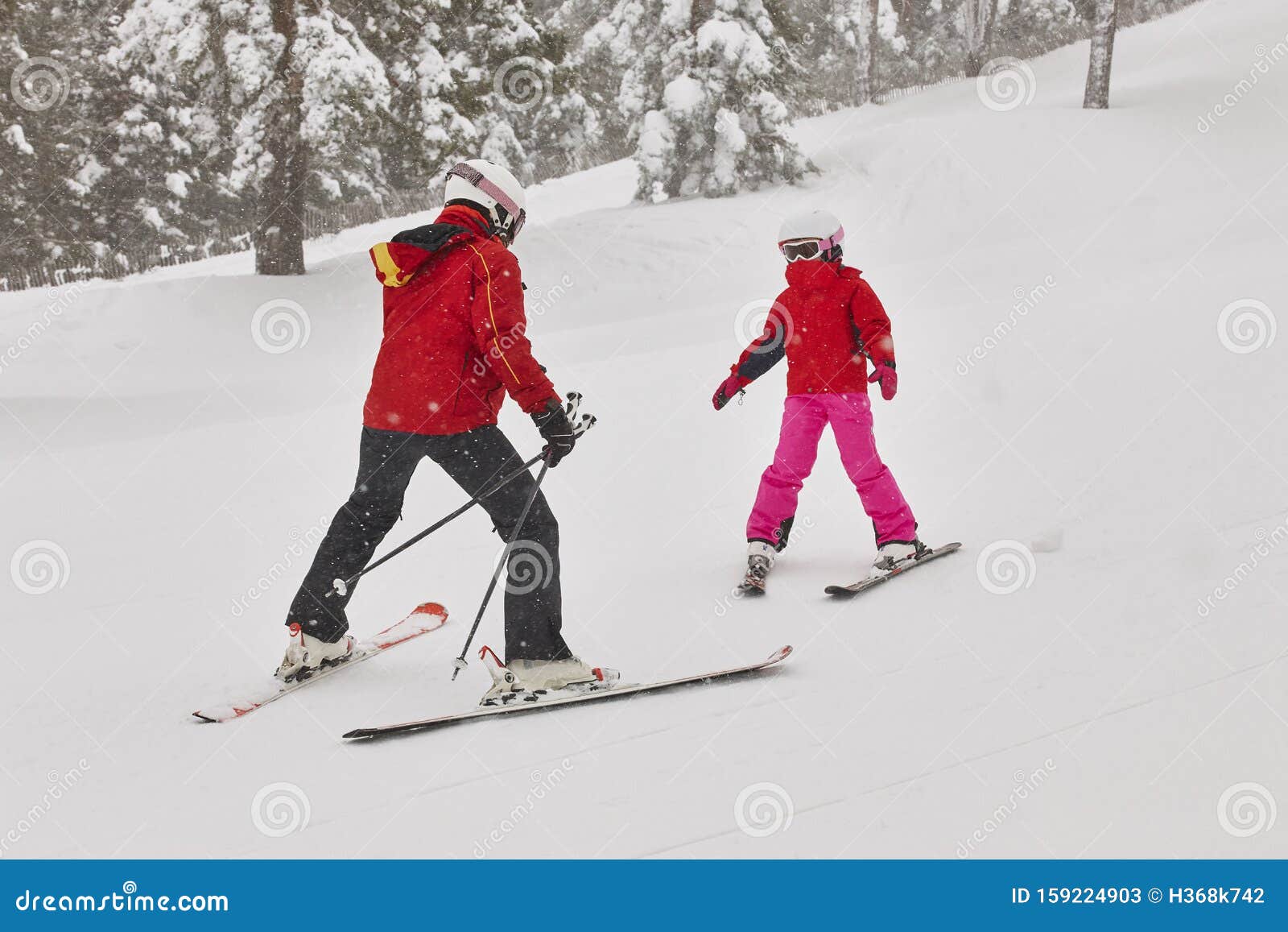 Child Learning How To Ski with an Instructor. Winter Stock Image ...