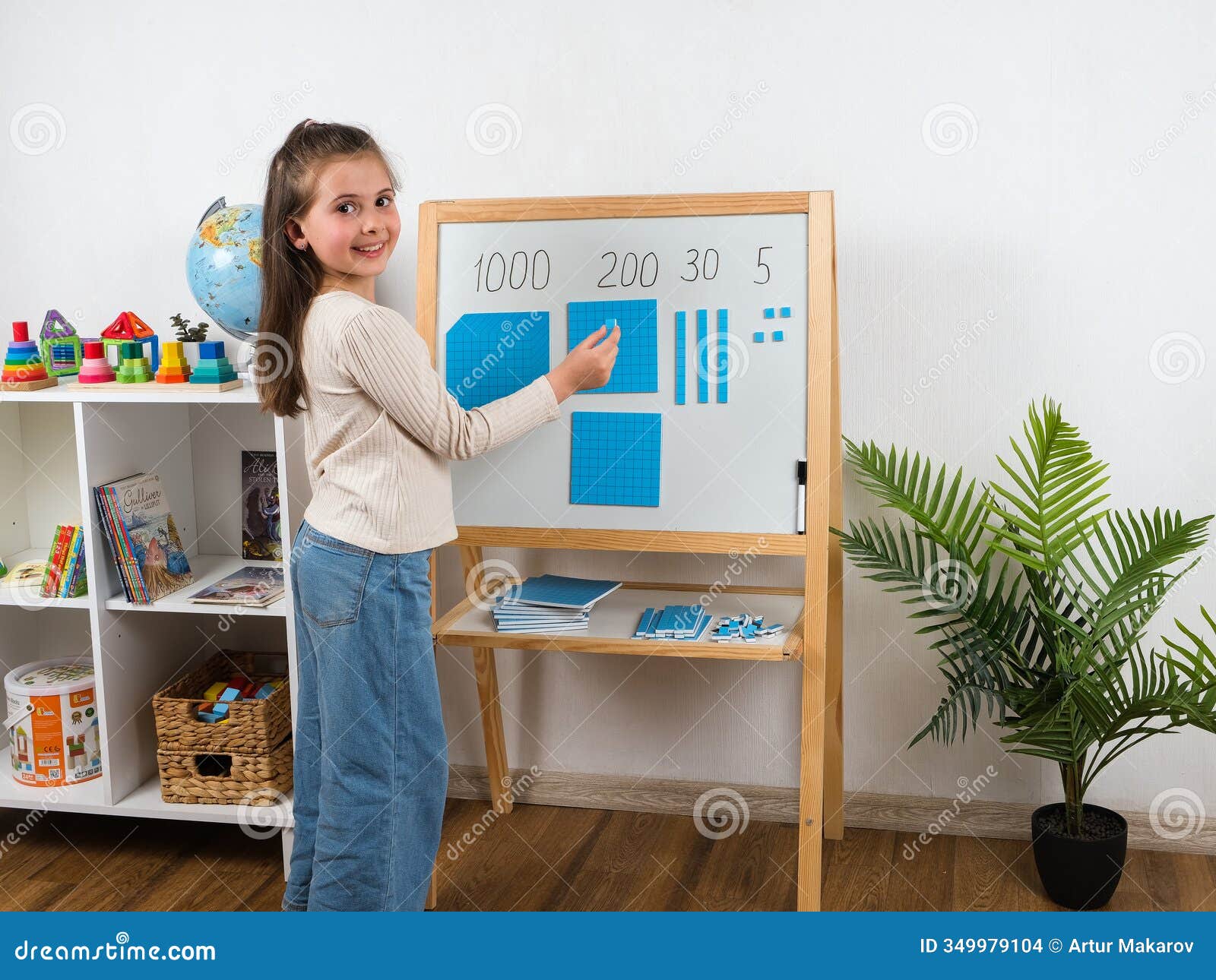 Girl Learning Math with Magnetic Frames and Counters Stock Photo ...