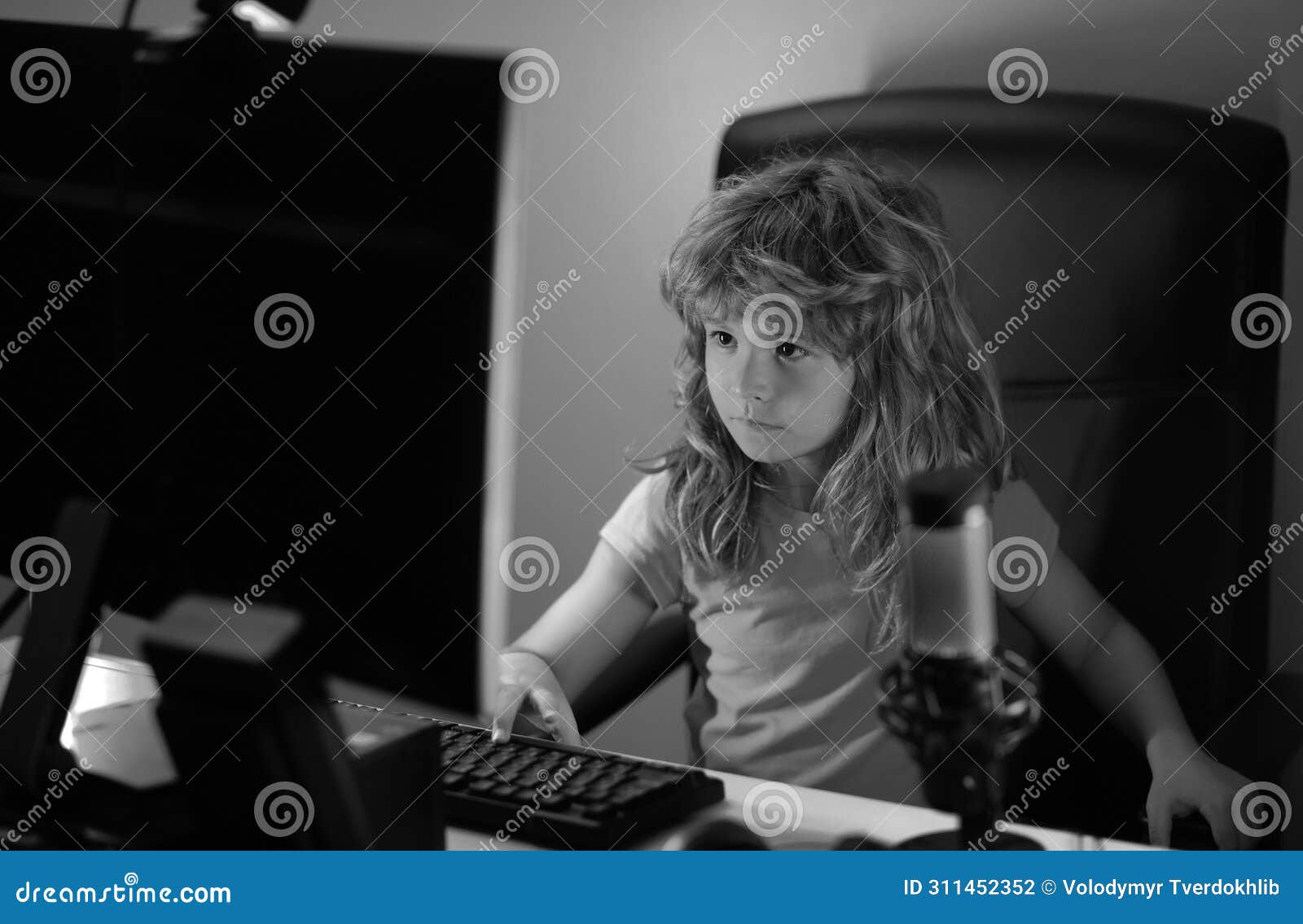 Child Learning Online at Night, Using Desktop Computer in Living Room ...