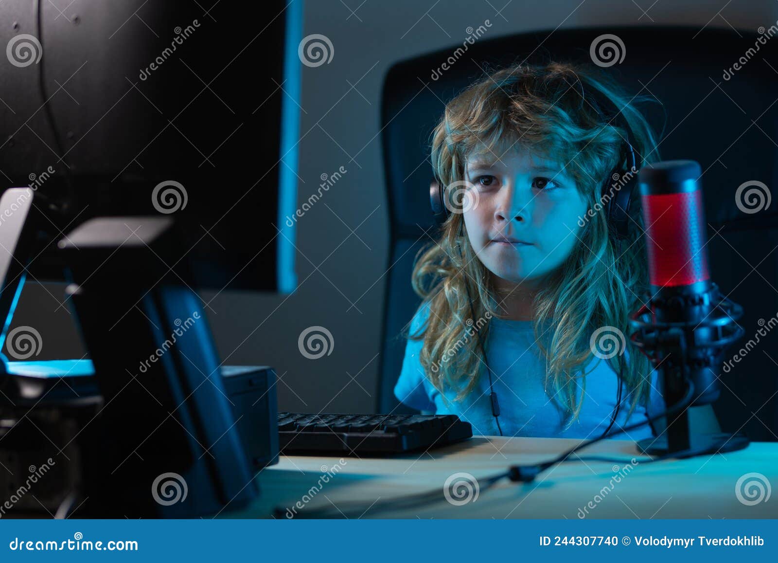 Child Learning Online at Night, Using Desktop Computer in Living Room ...