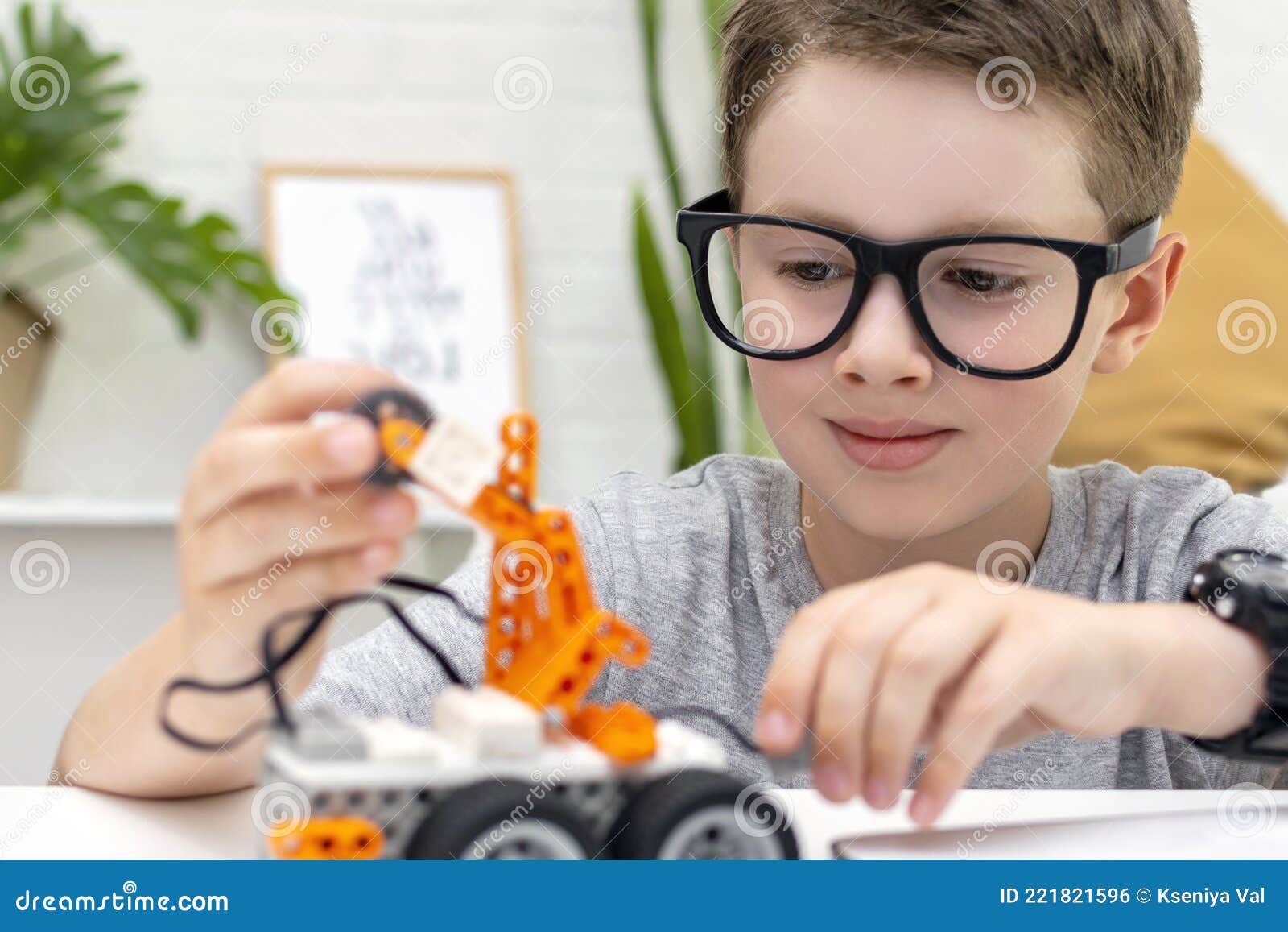The Child Learns Coding and Programming and Constructs a Robot Car ...