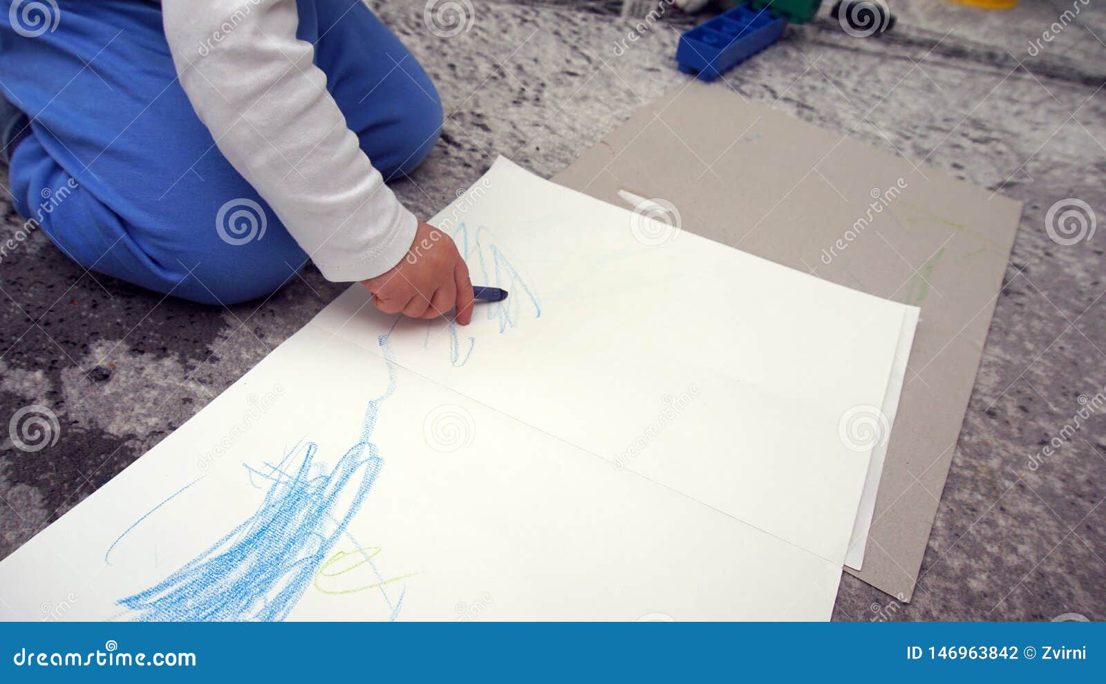 The Child Learns To Draw Wax Crayons on the Floor Stock Photo - Image ...
