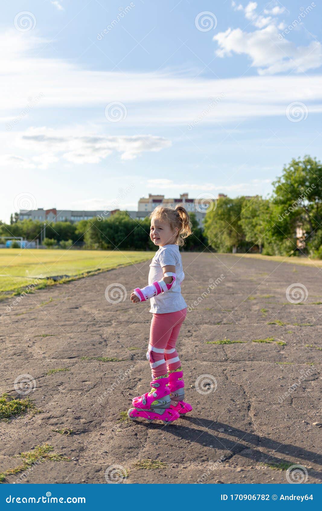 Child Learns To Roller Skate. Roller Skating Stock Photo - Image of ...
