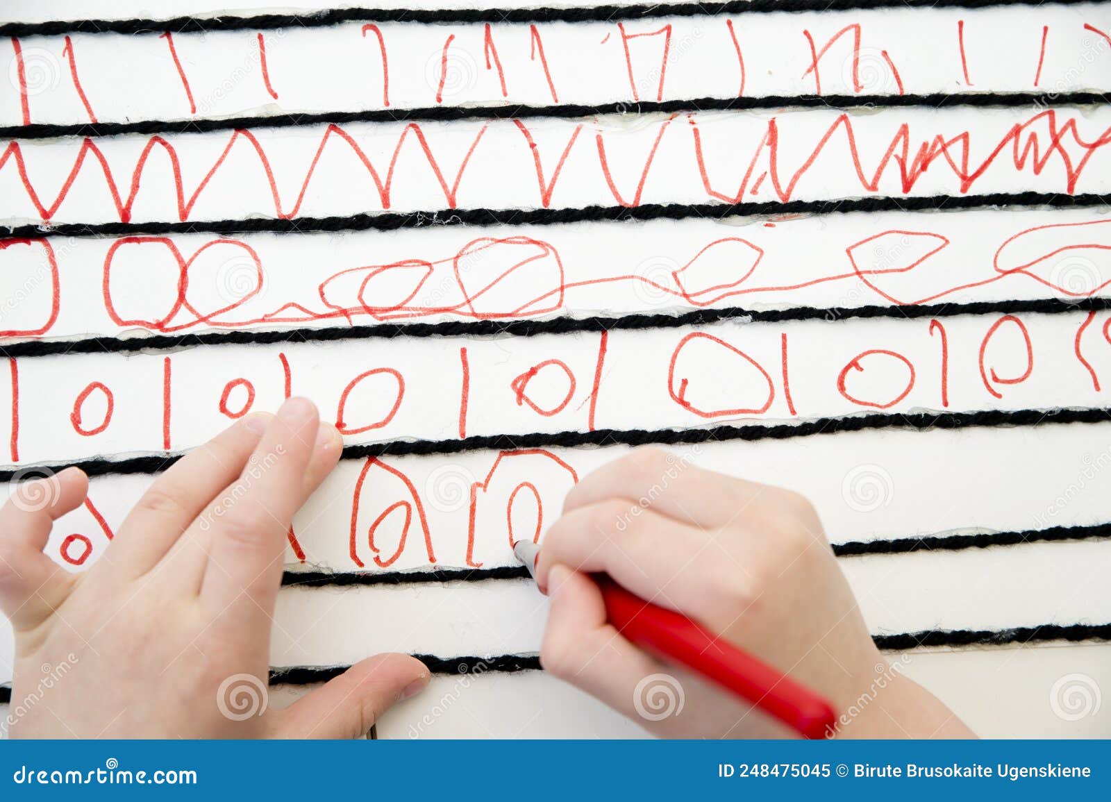 Child Learns To Write Symbols. Hand Training Tasks. Stock Image - Image ...
