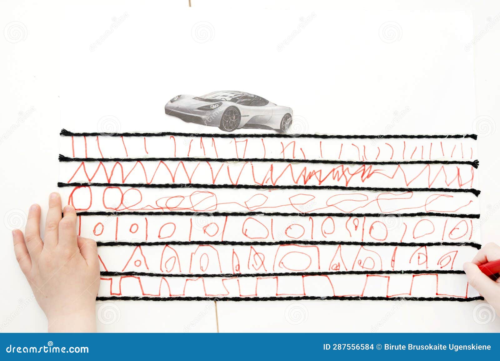 Child Learns To Write Symbols. Hand Training Tasks Stock Photo - Image ...